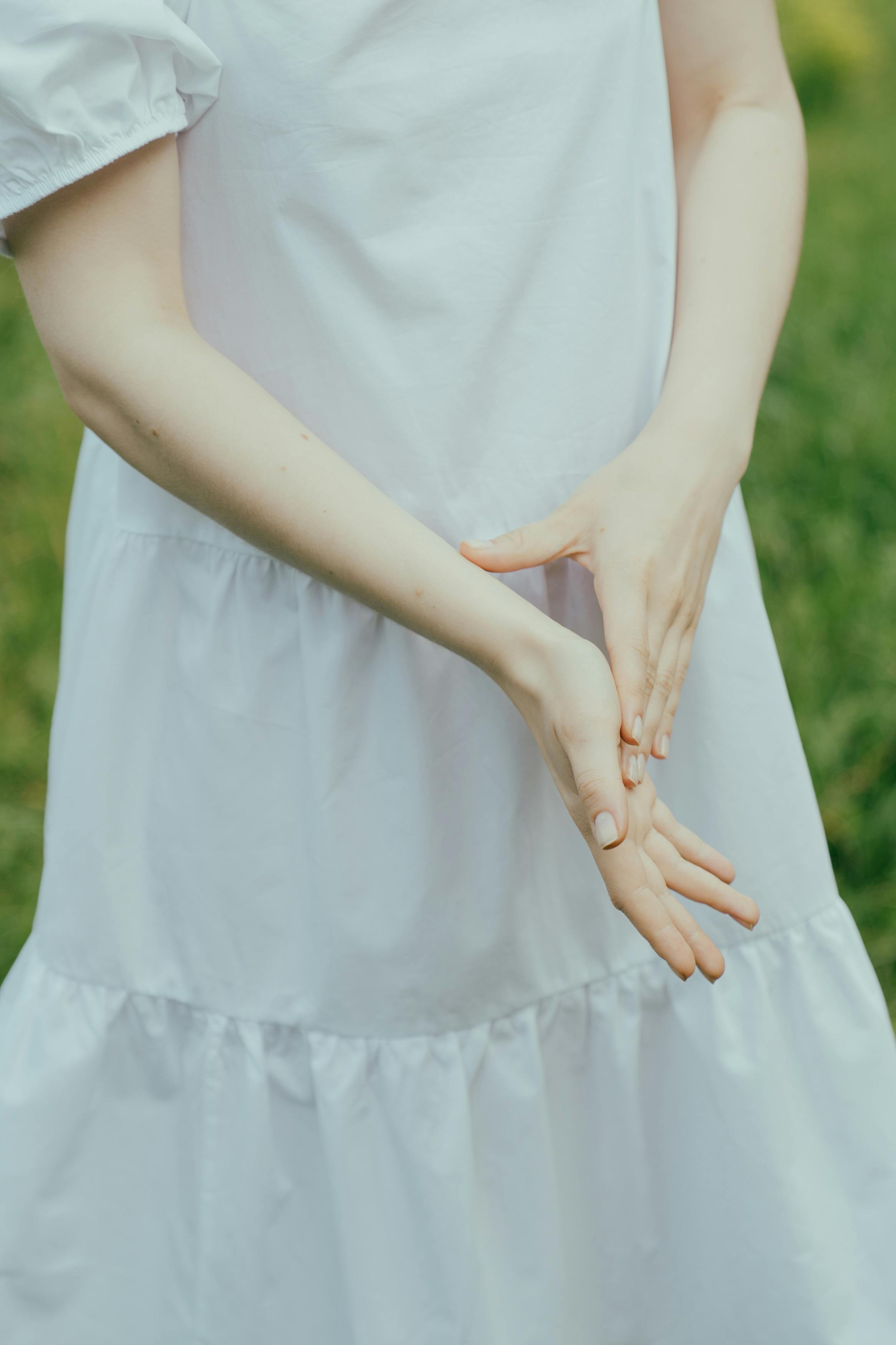 Close-Up Photo of a Person's Hand Touching Body of Water · Free Stock Photo