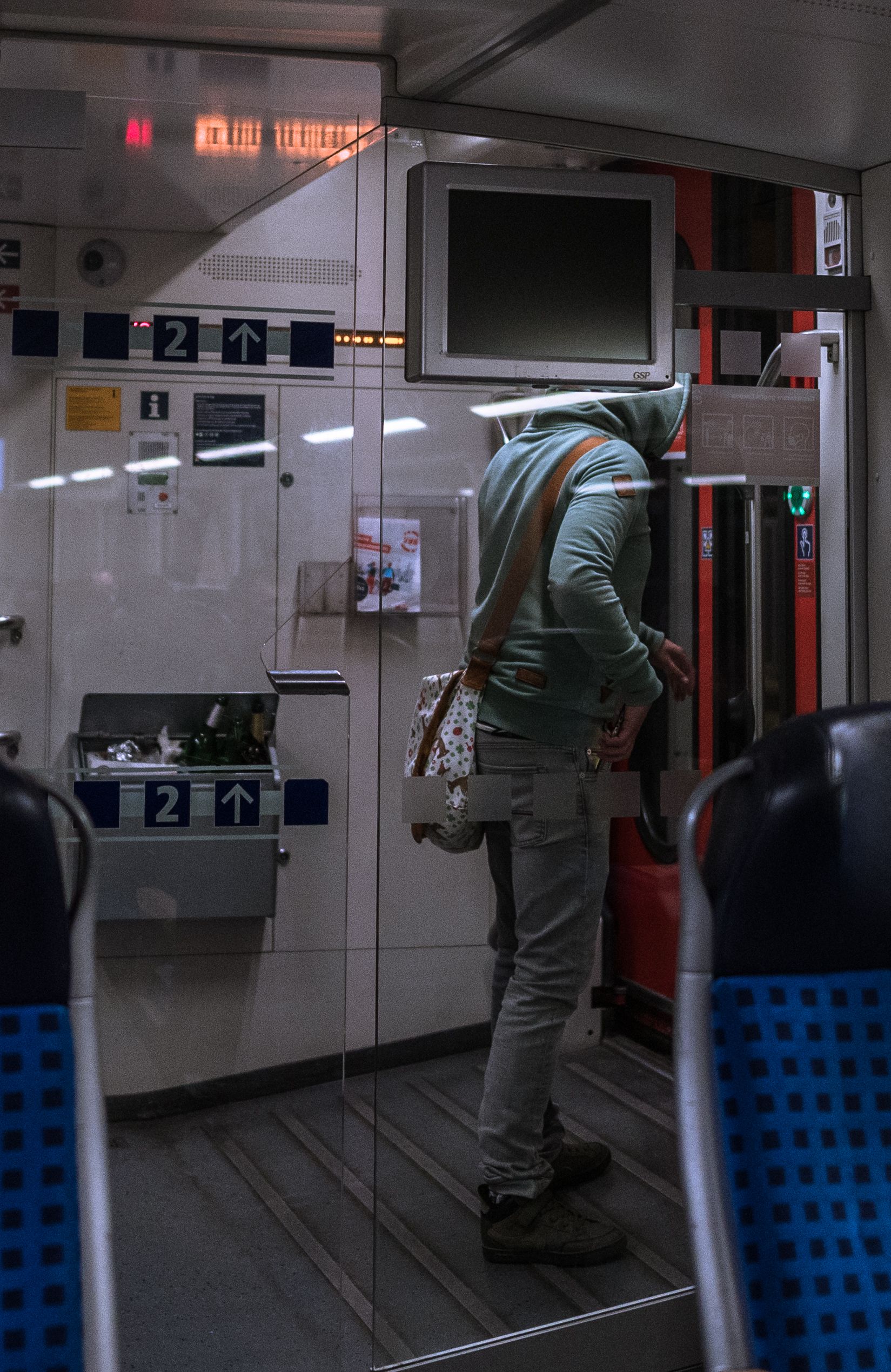 A Man in Brown Shirt Sitting on Train Seat · Free Stock Photo