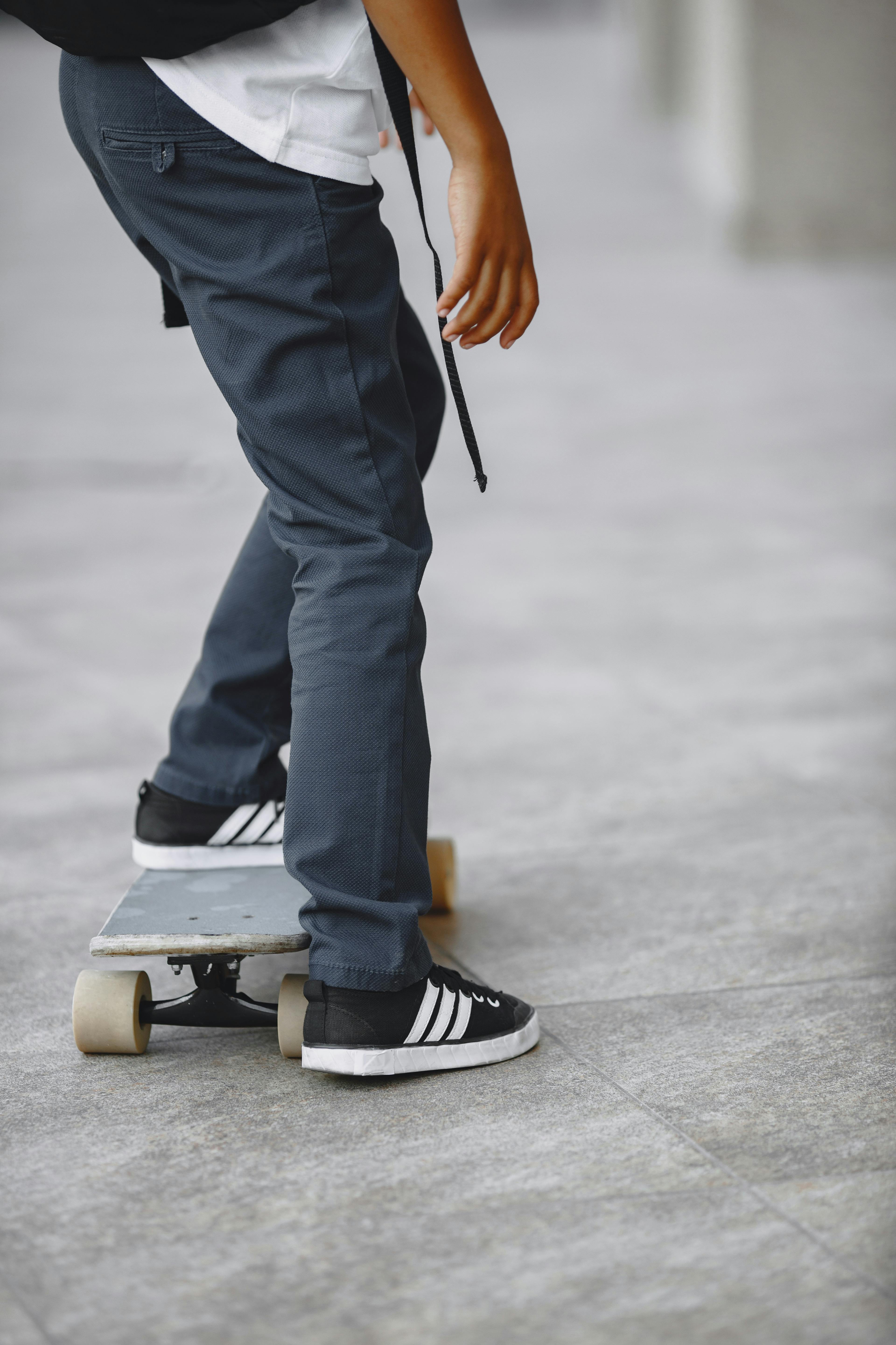 People Riding Skateboards at the Parking Area · Free Stock Photo