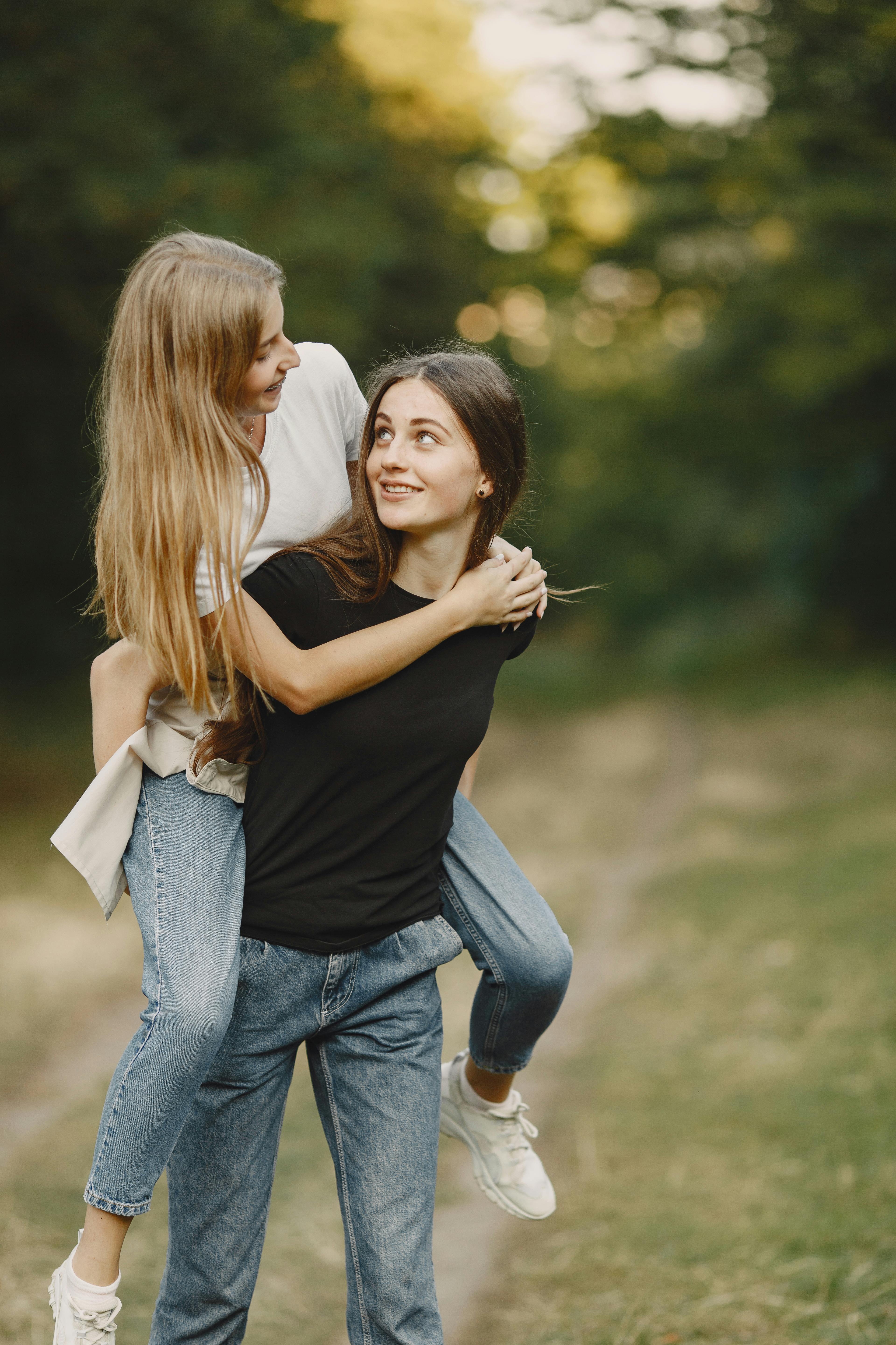 Woman Carrying other Woman Piggyback · Free Stock Photo