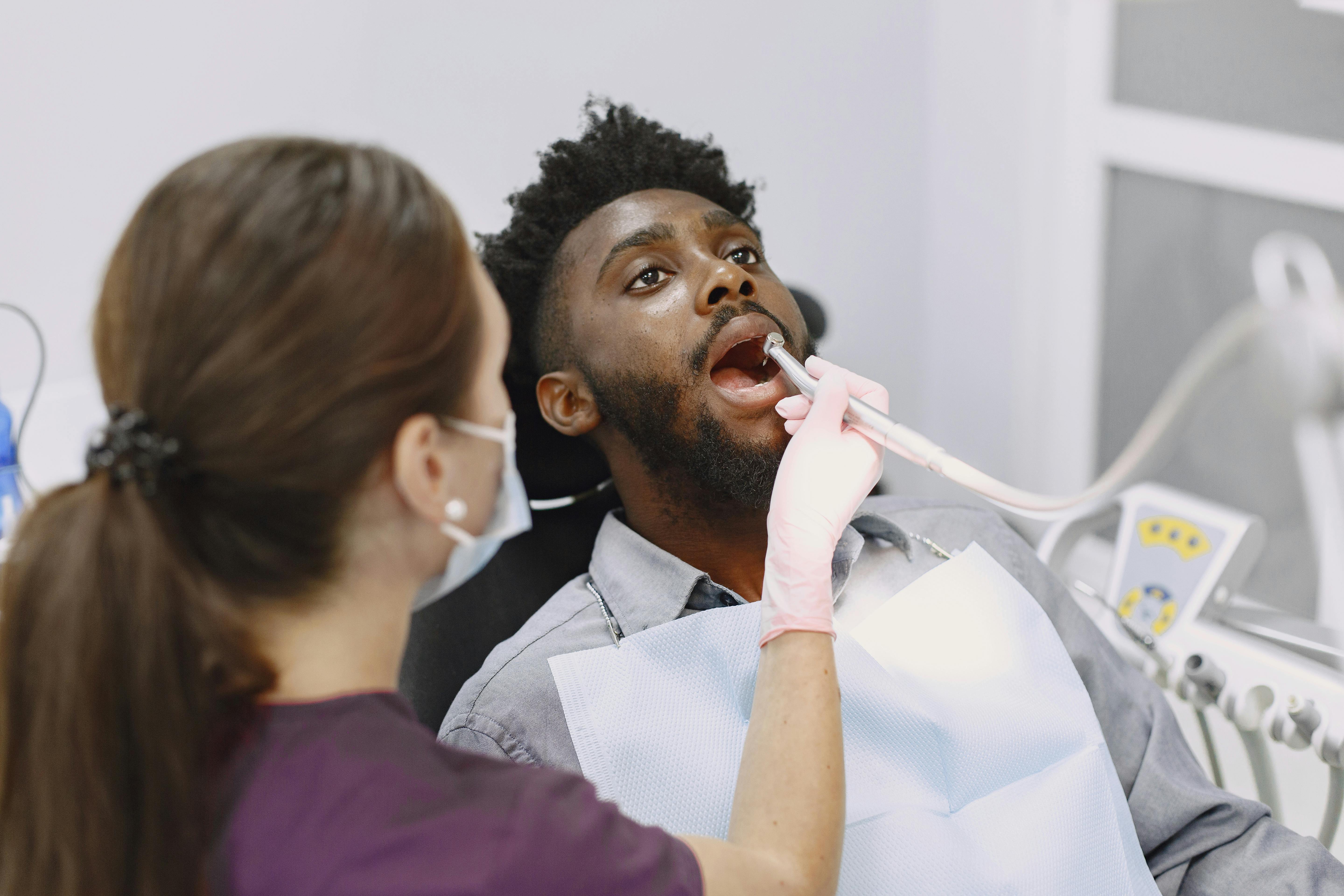 Dentist Holding Drill · Free Stock Photo