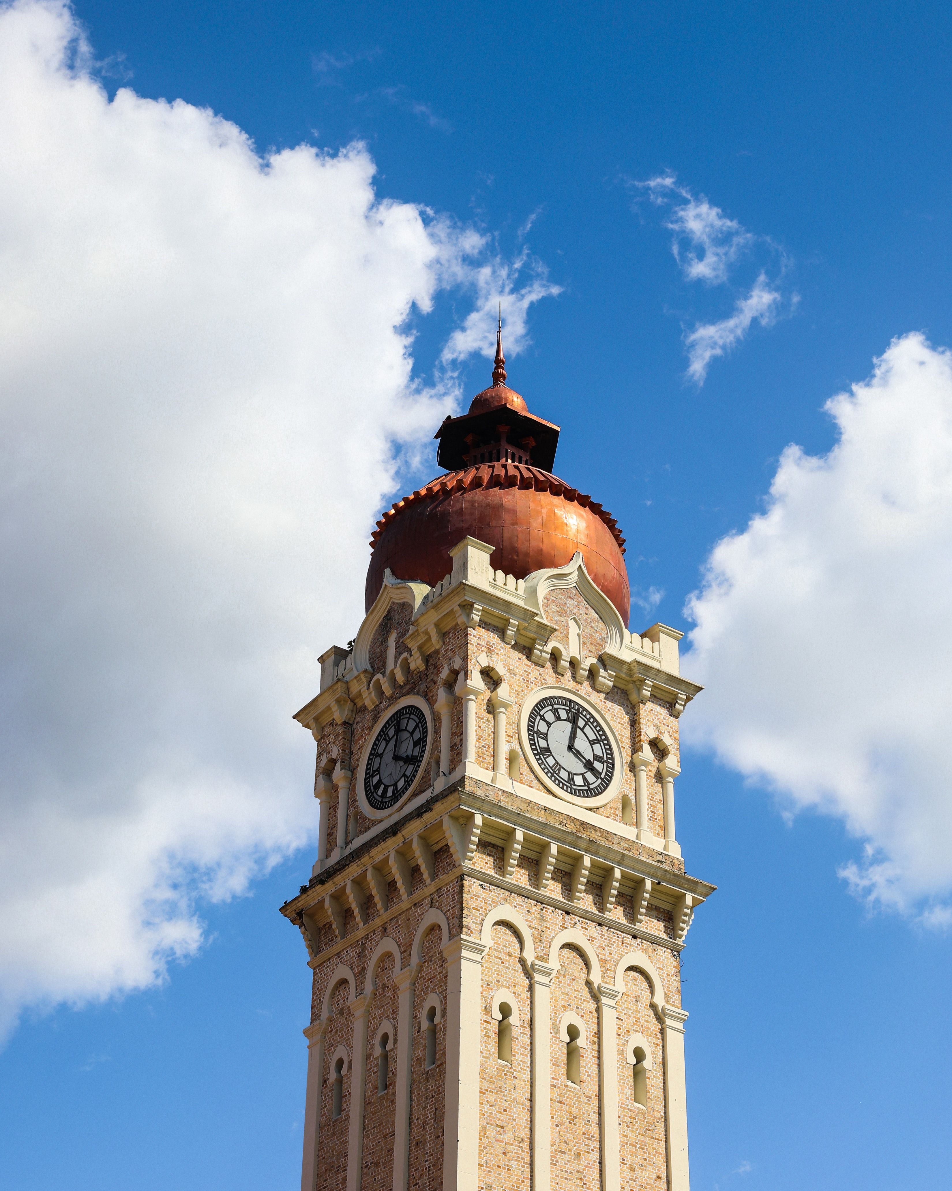 Brown and White Clock Tower Under the Blue Sky · Free Stock Photo