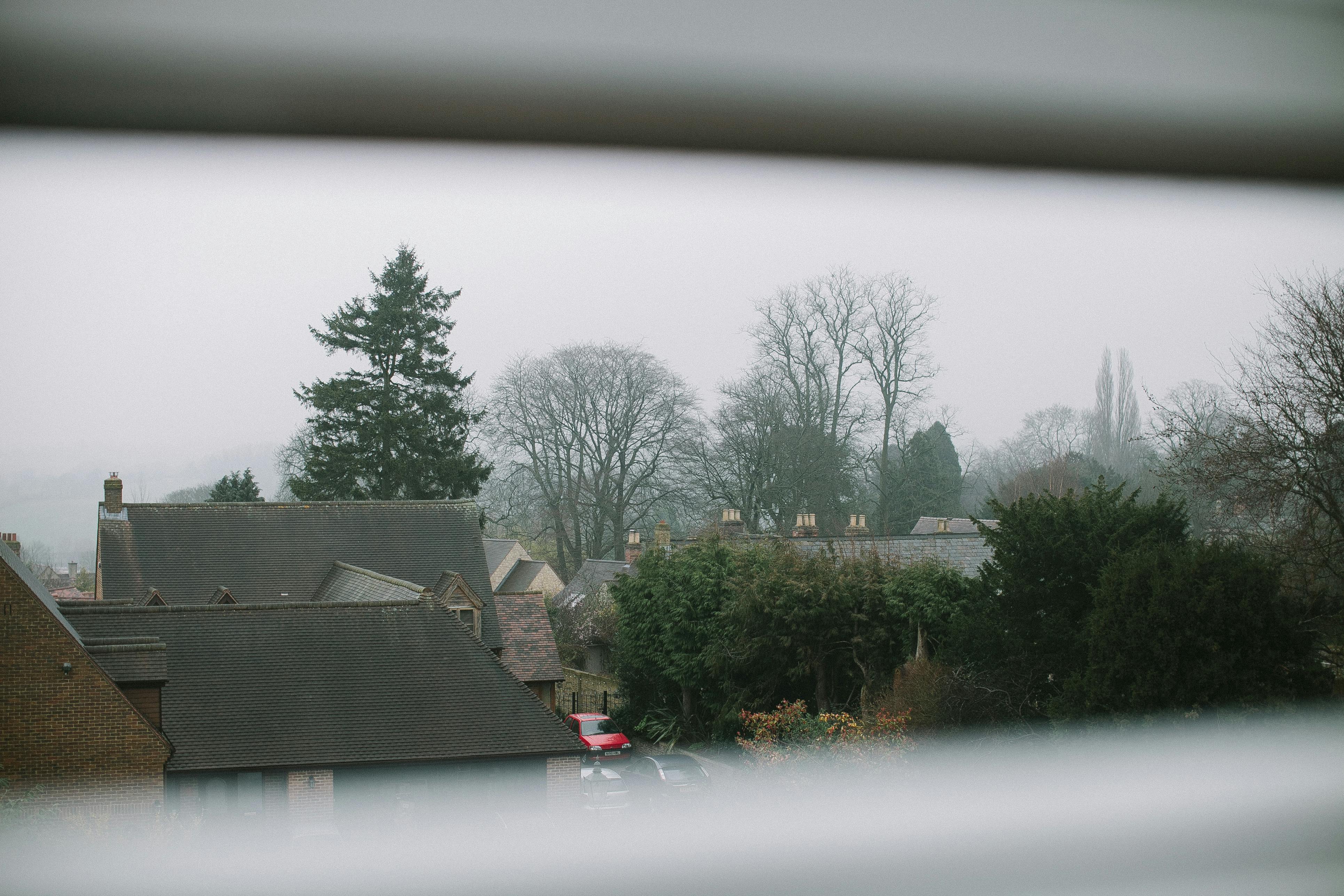 Suburban Neighbourhood Seen Through Window Blinds · Free Stock Photo