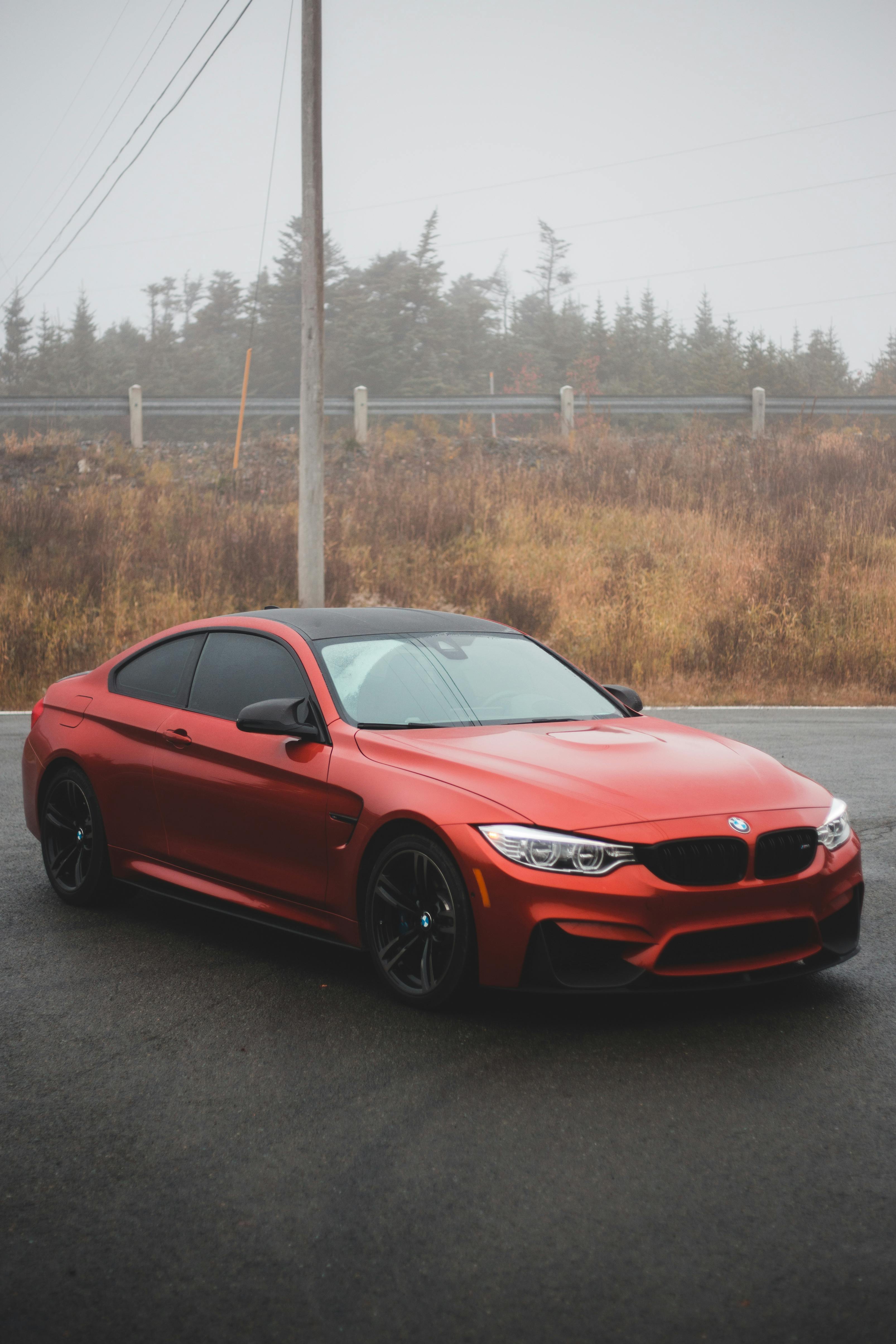 Red coupe car on asphalt road · Free Stock Photo