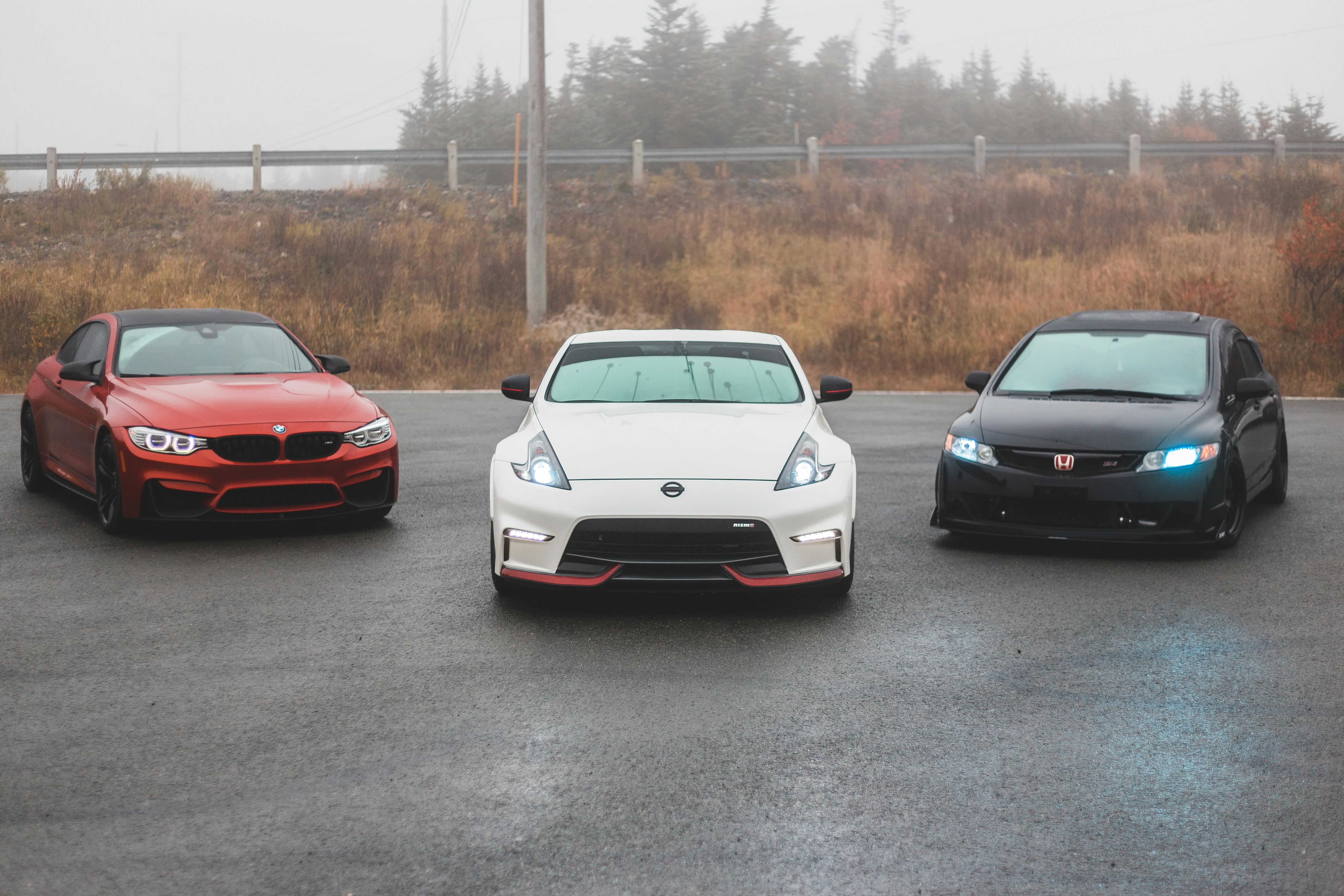 Modern vehicles with bright headlights on road · Free Stock Photo