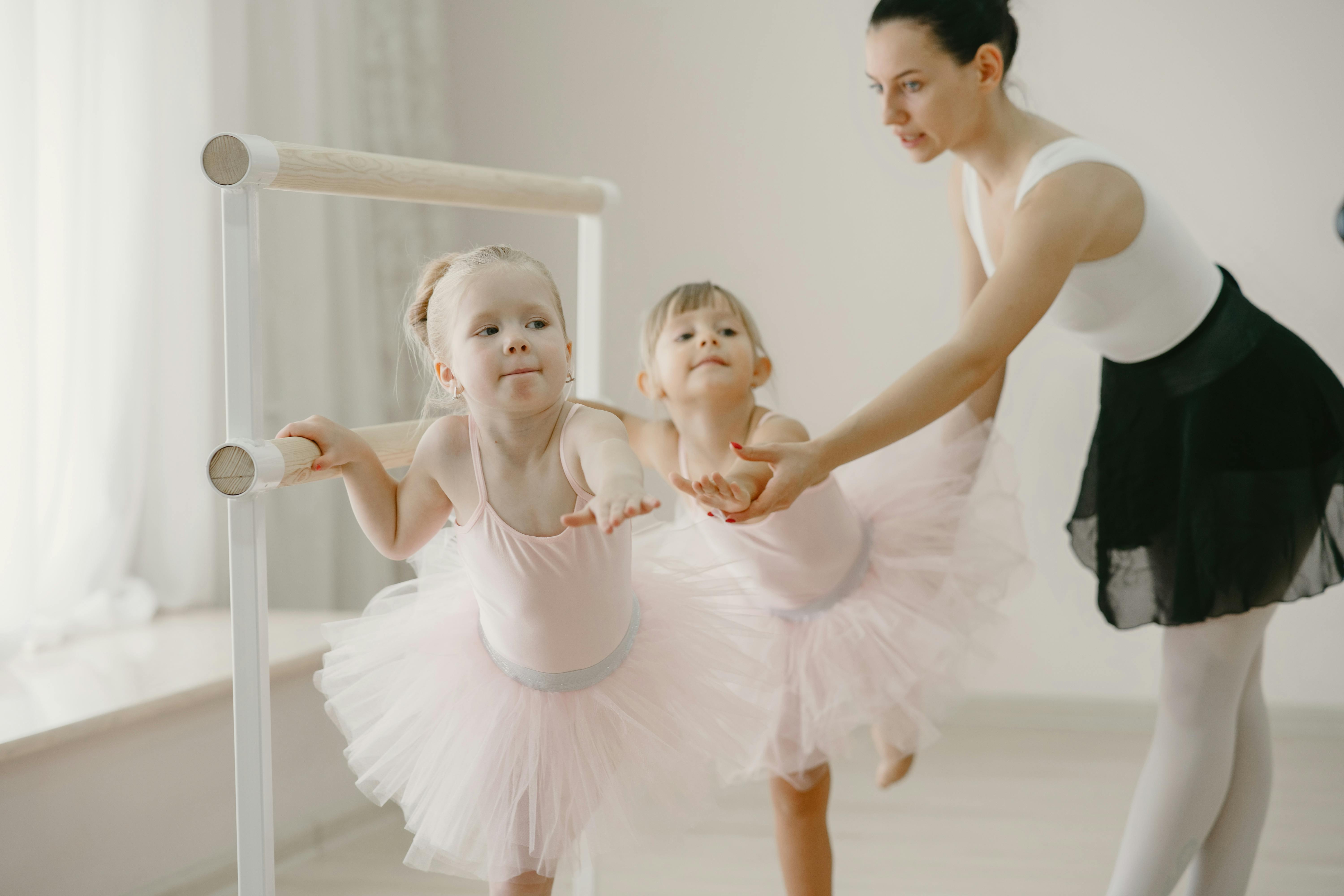 Happy Asian girl with teacher in ballet class · Free Stock Photo