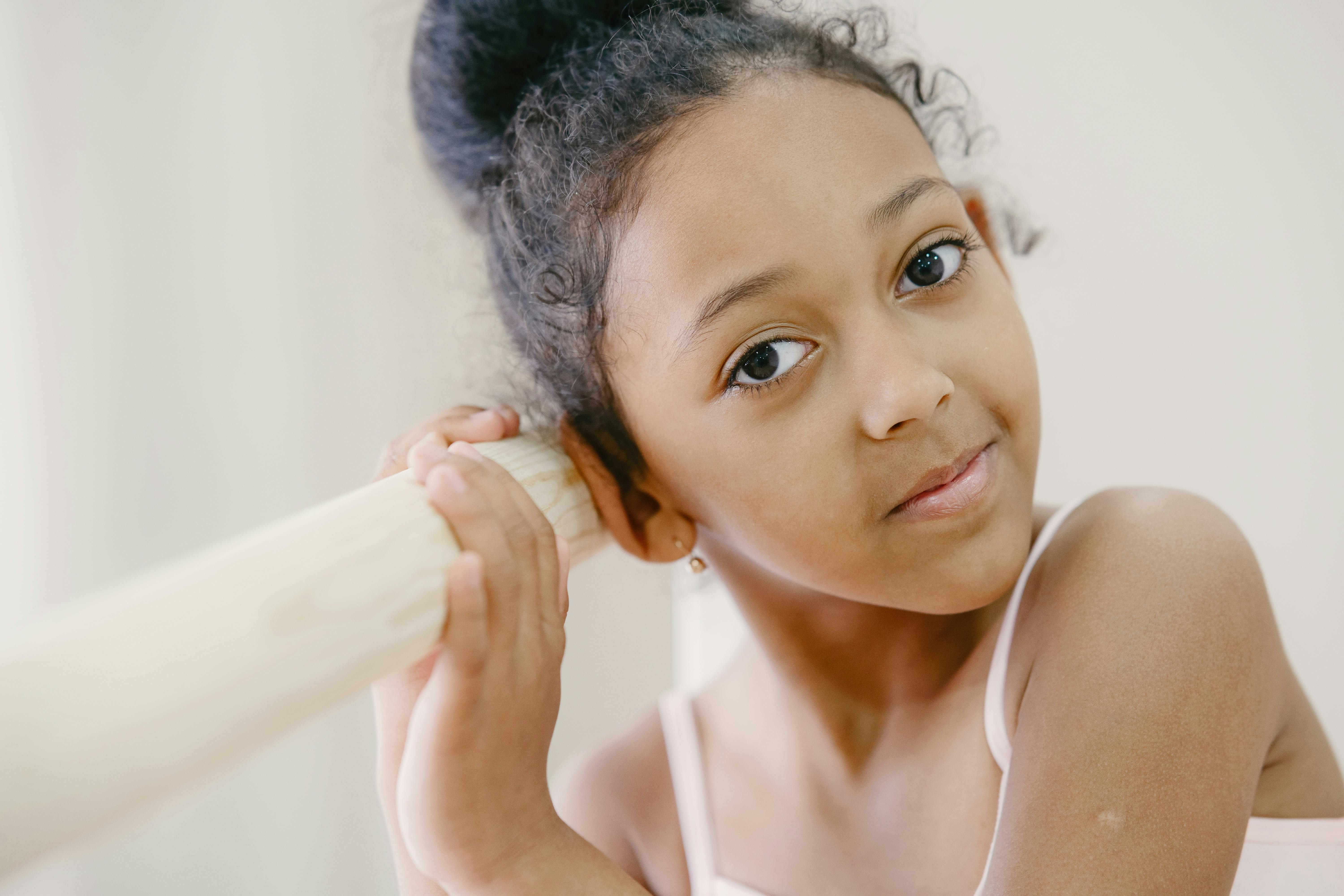 Baby Wearing Red Crew-neck Shirt Near Pink and Black Floral Surface ...