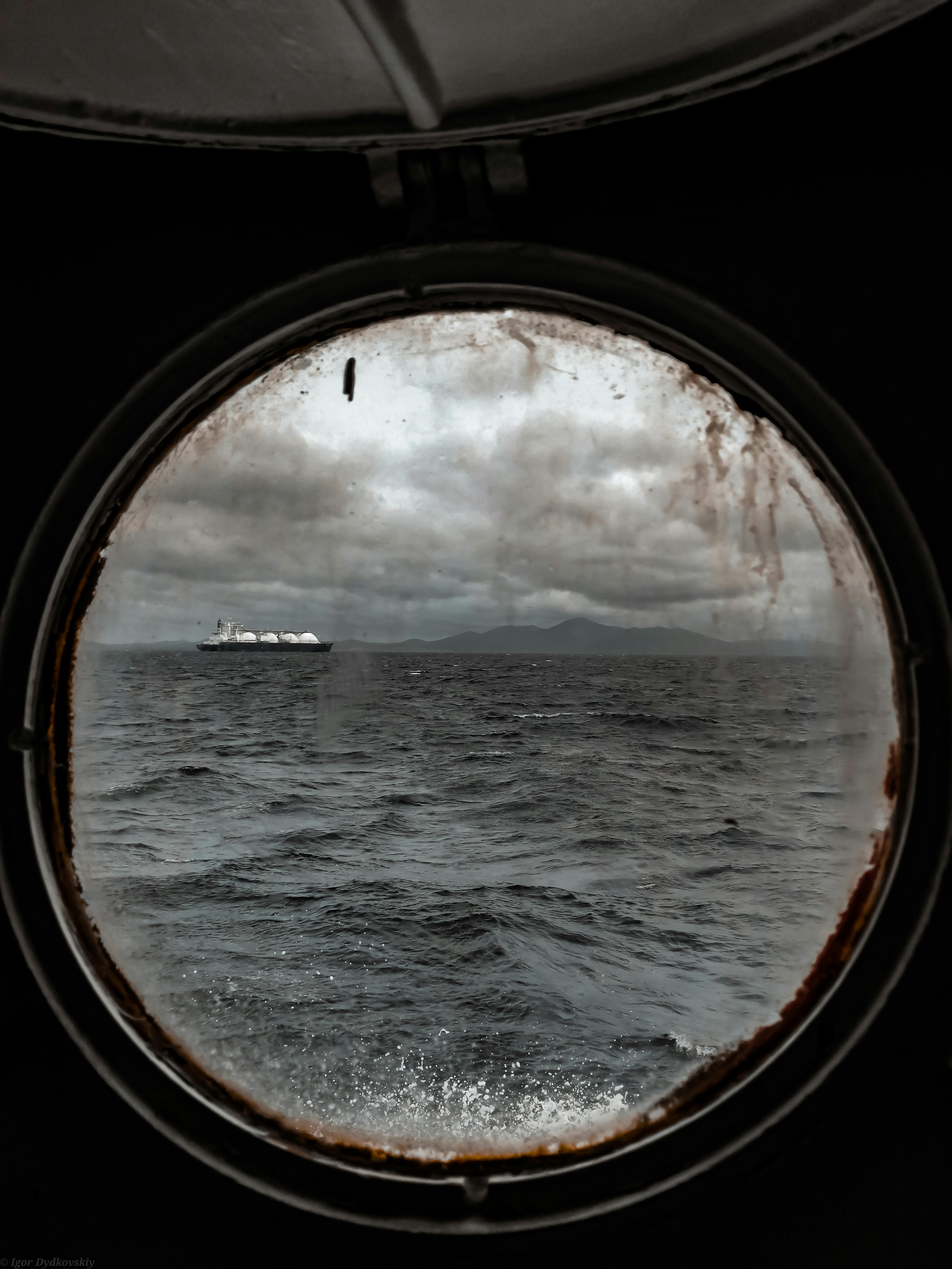 Ocean View From Round Ship Window · Free Stock Photo