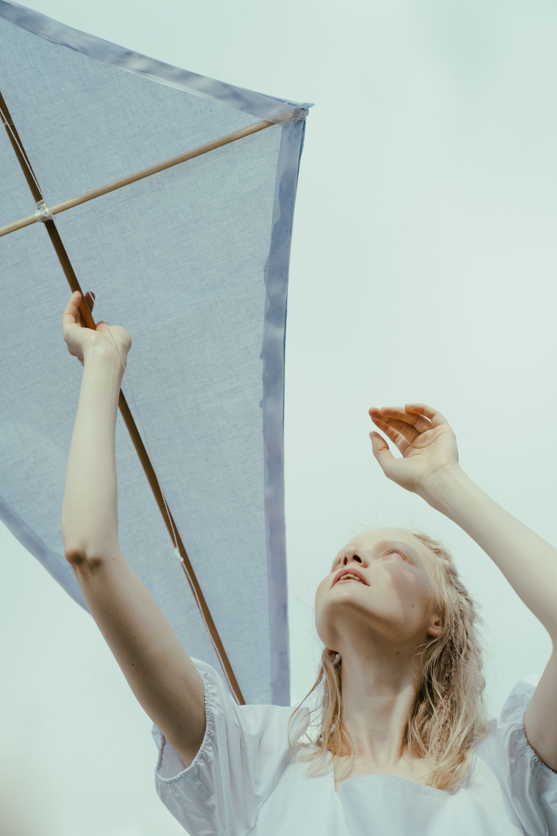 Women in White Dress Holding a Kite · Free Stock Photo