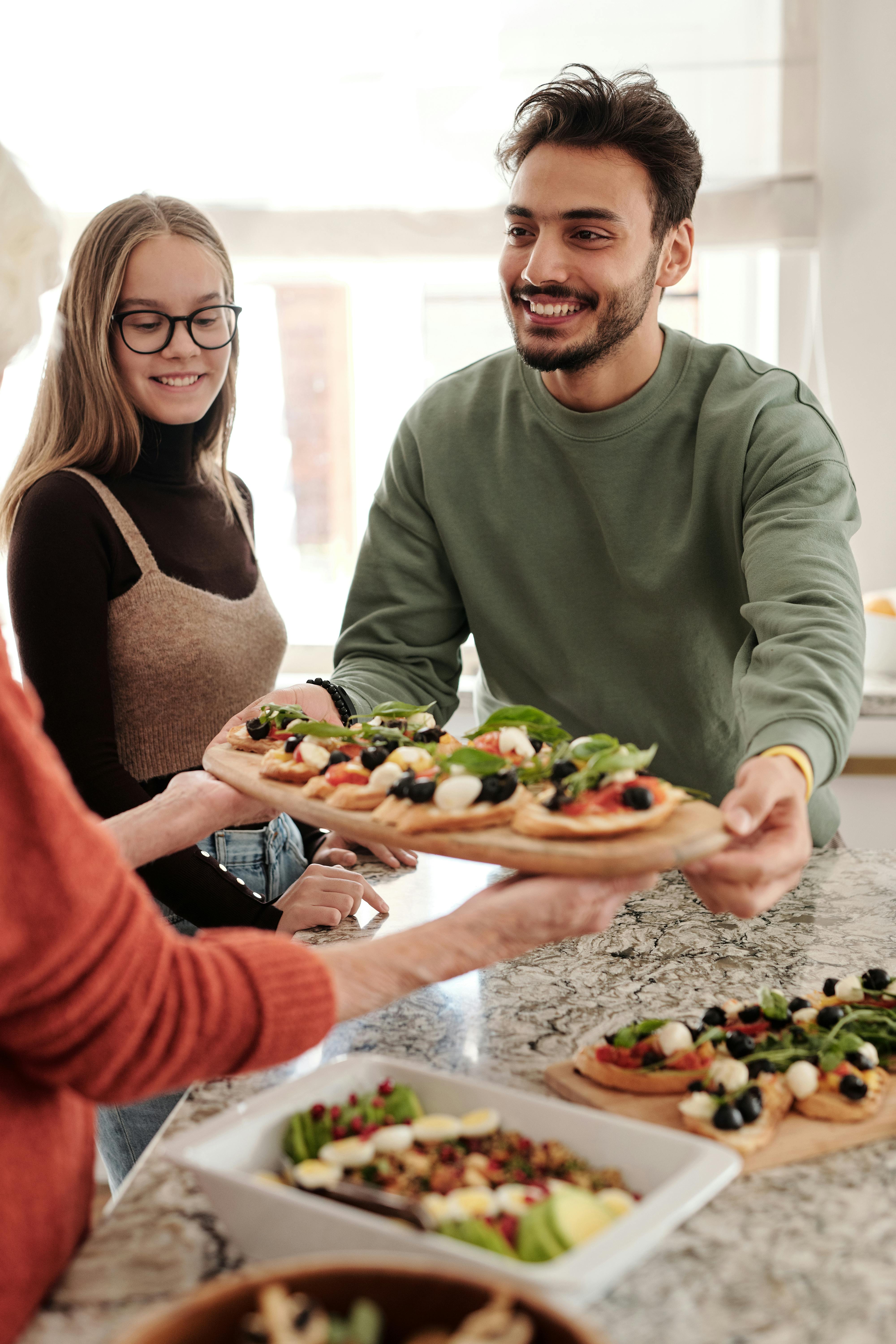 A Man Offering Food to an Old Woman · Free Stock Photo