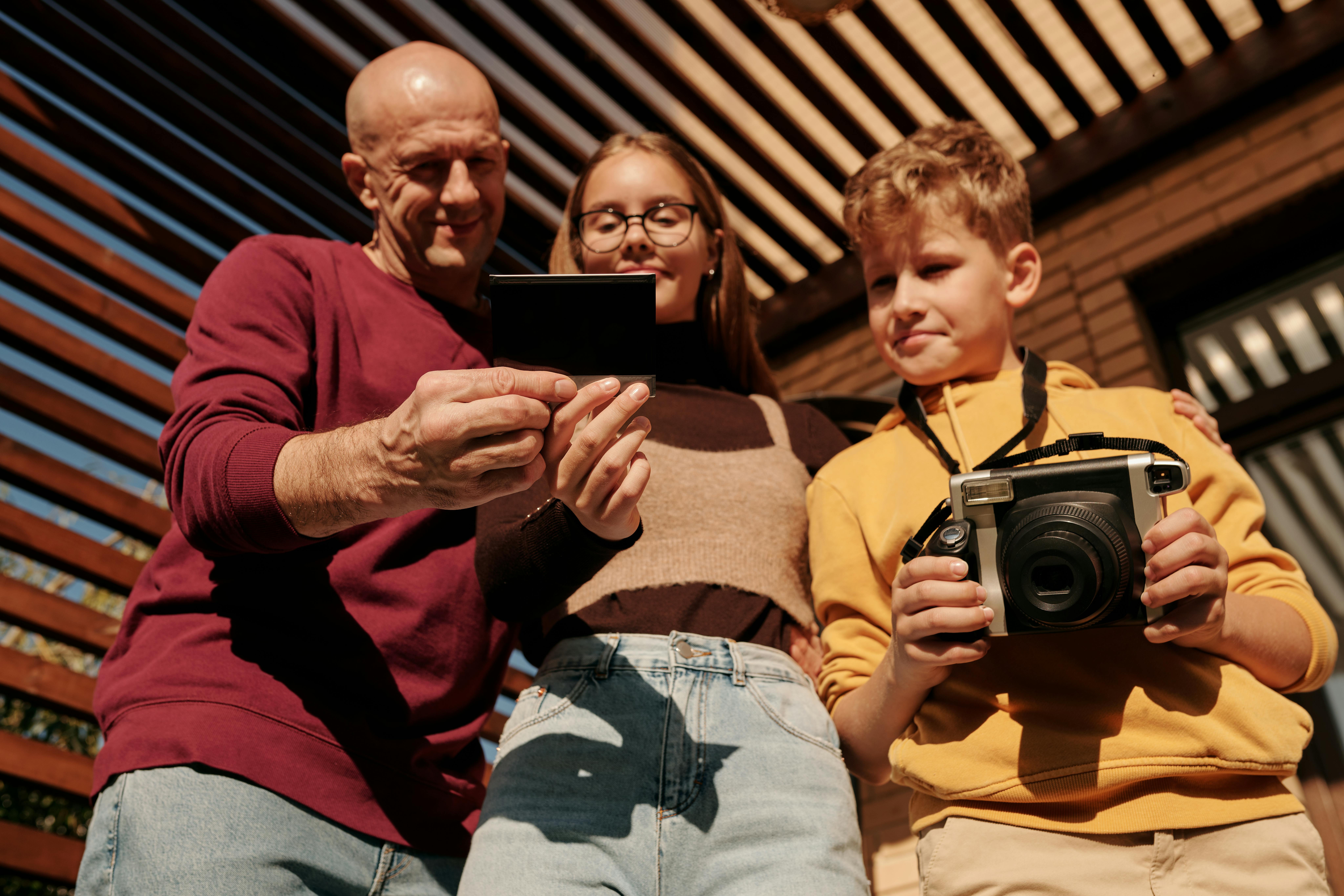 People Looking at a Photo · Free Stock Photo