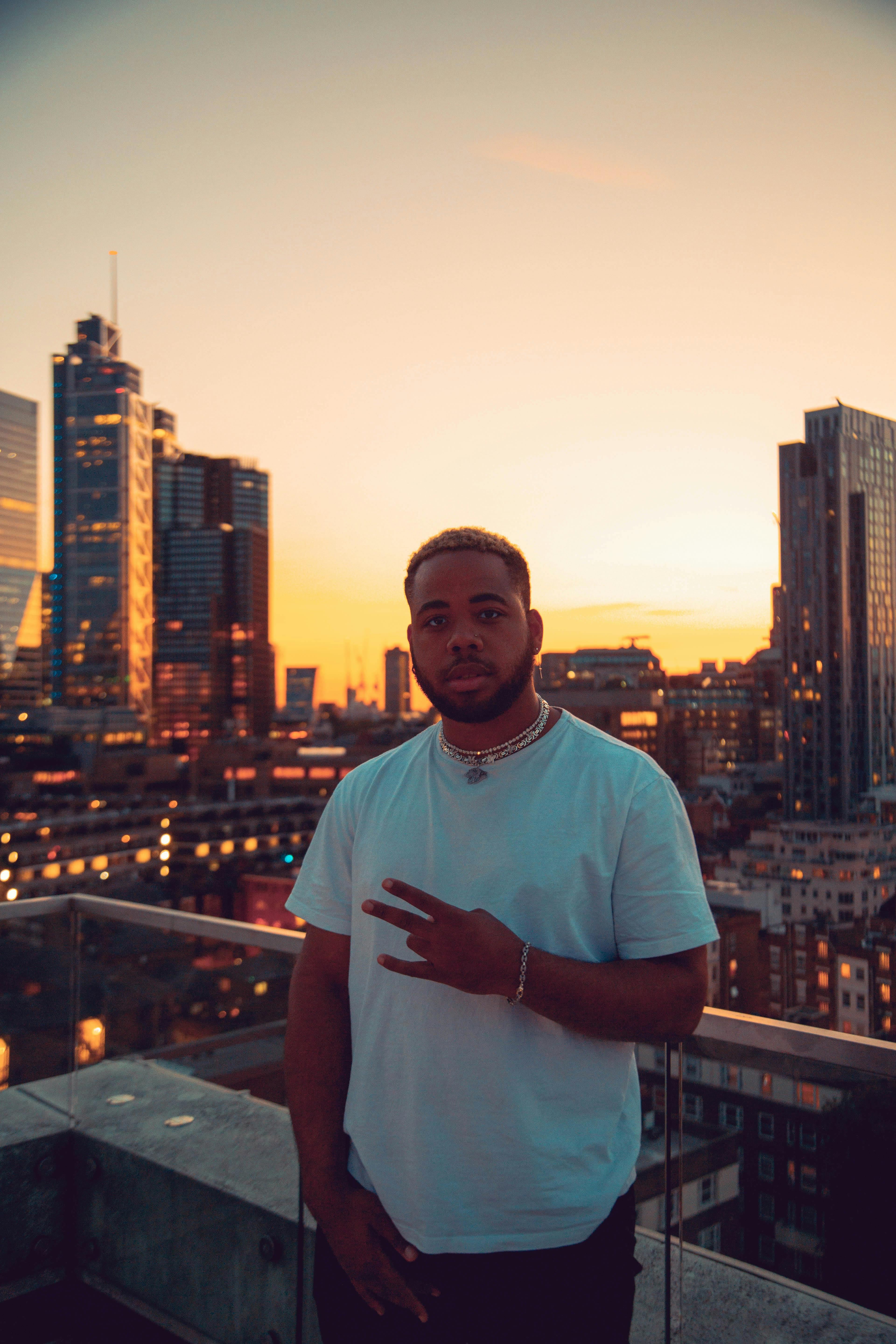 Man in White Shirt Doing Peace Sign · Free Stock Photo