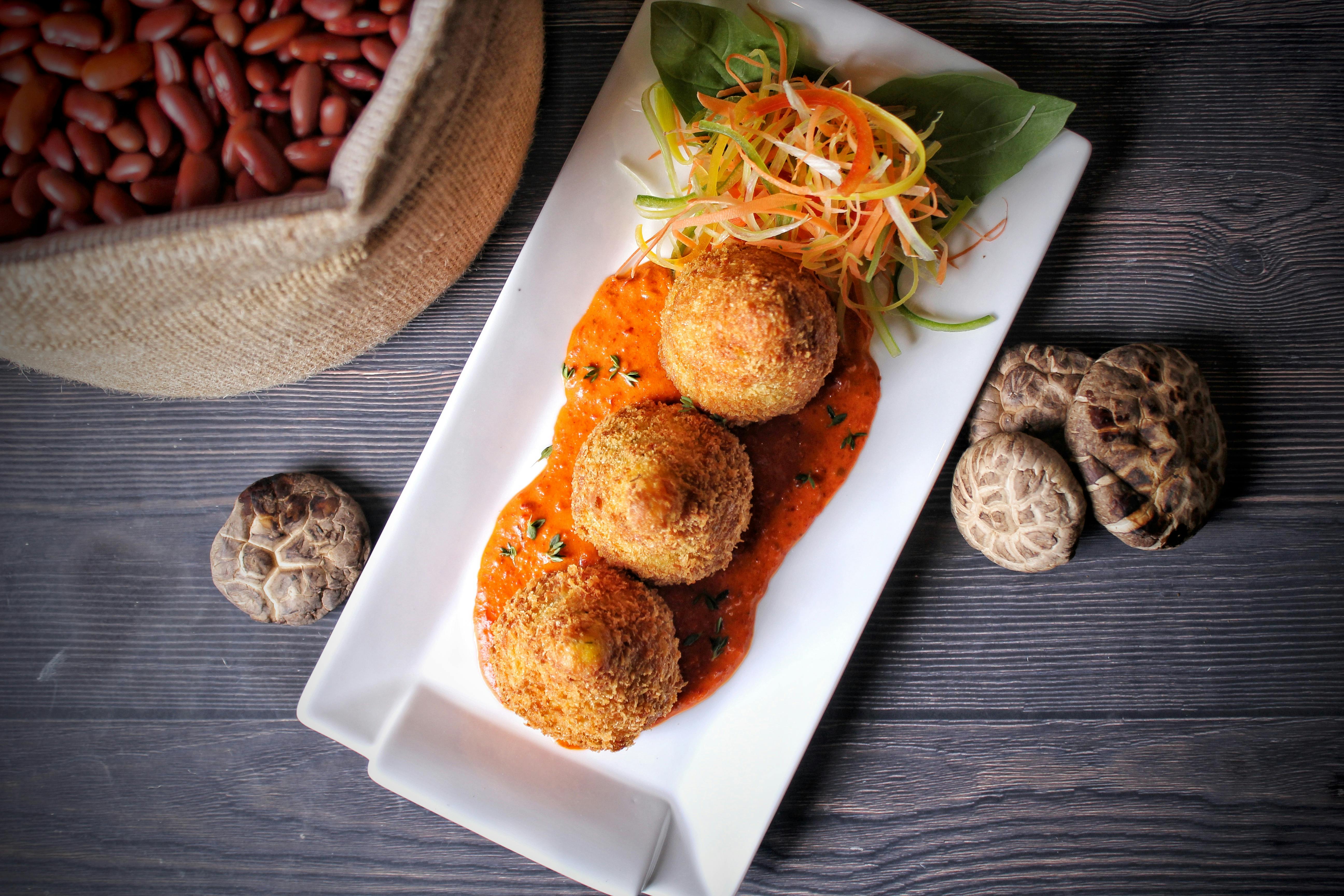 Close-Up Shot of a Fried Food on a White Plate · Free Stock Photo