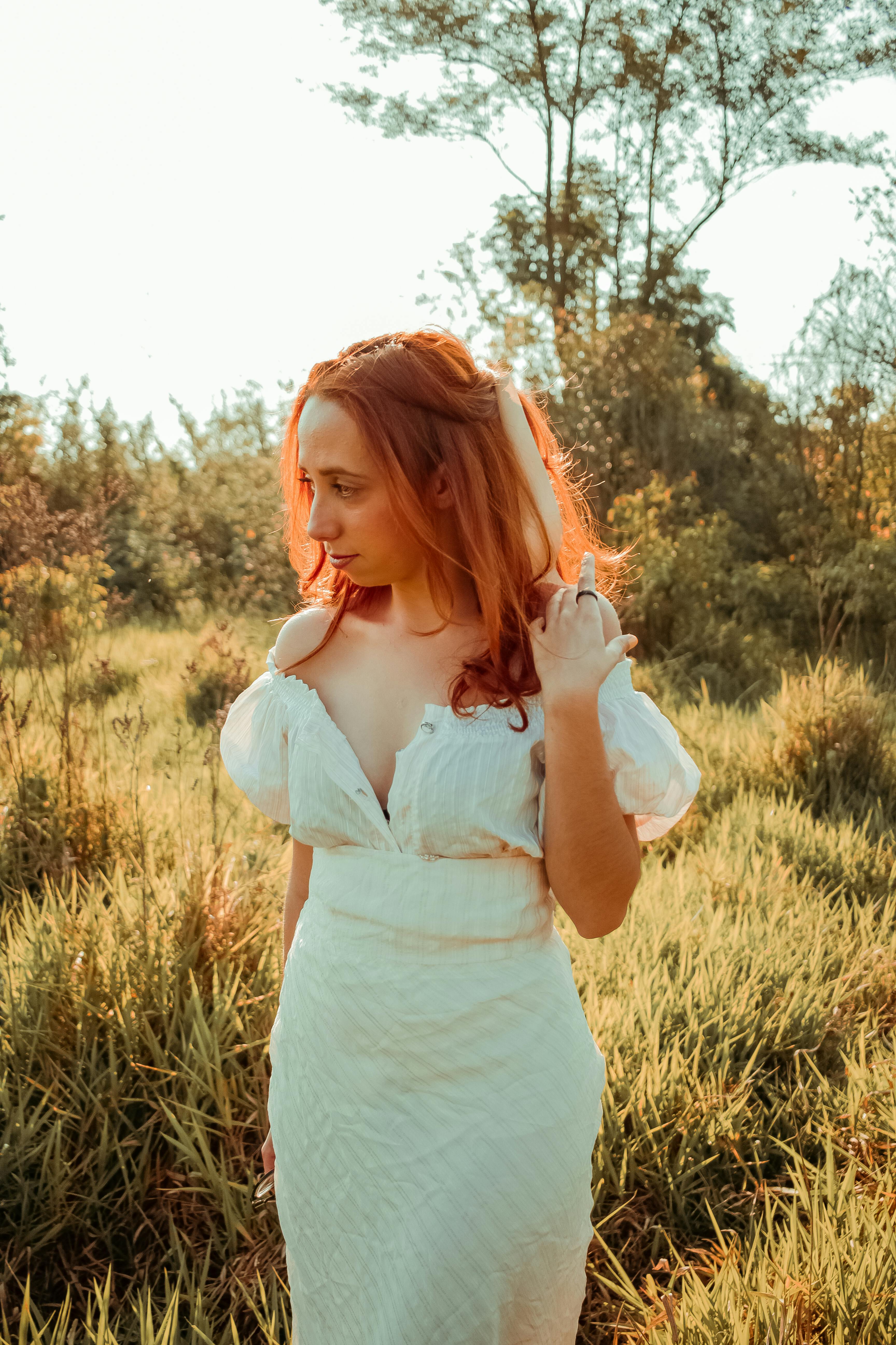 Young woman with red hair in trendy summer dress · Free Stock Photo
