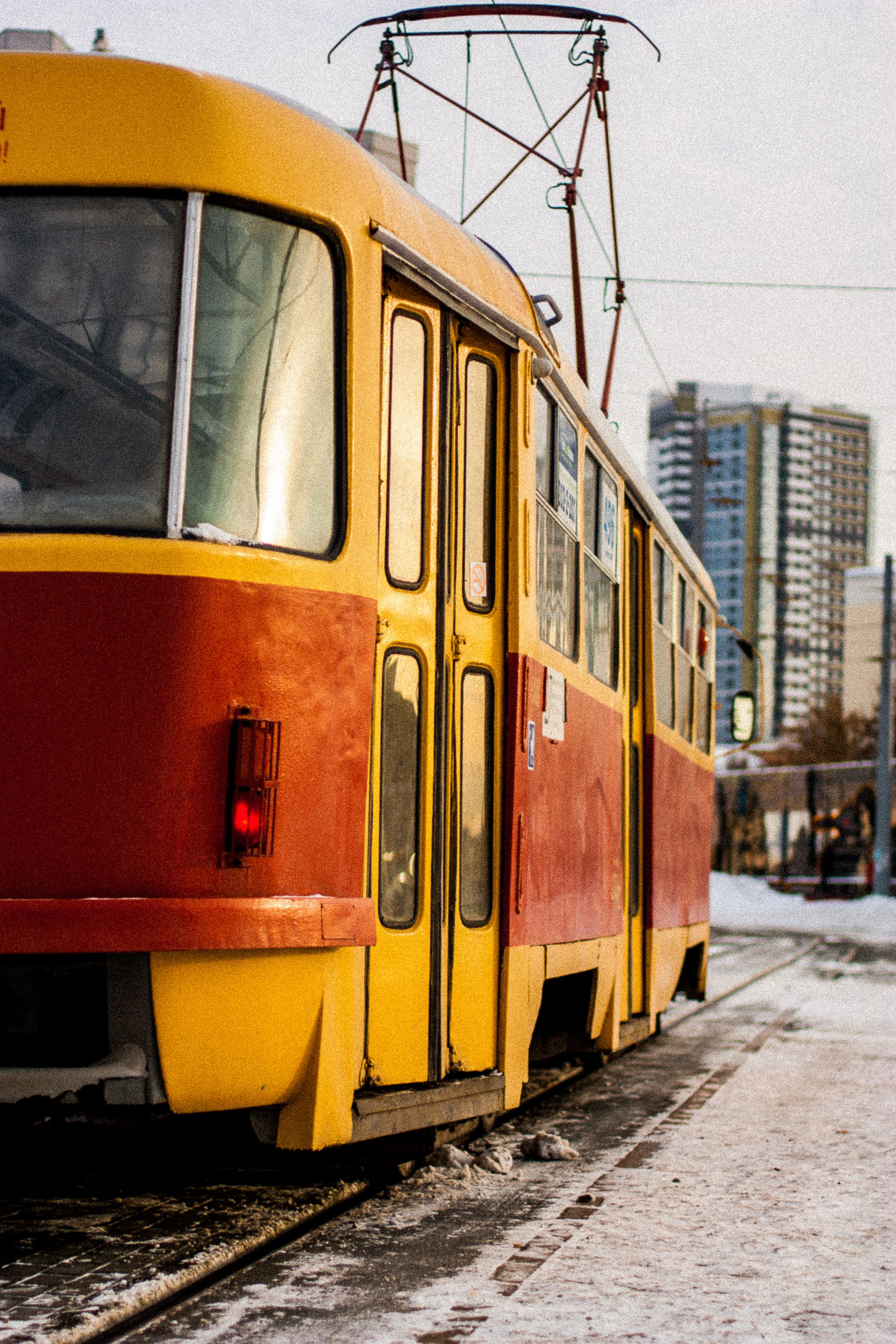 Yellow and White Trams on Tramway · Free Stock Photo
