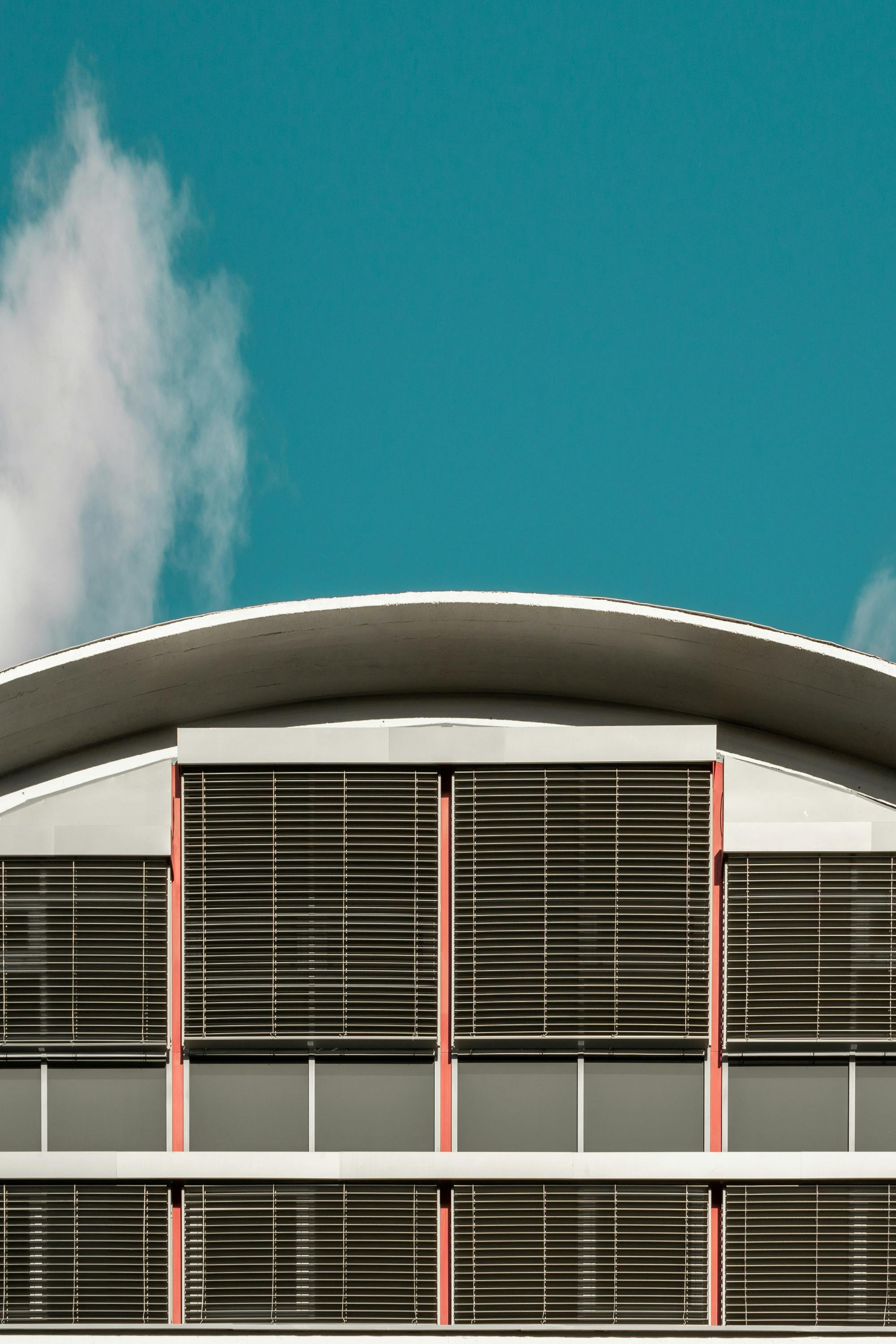 White and Red Building Under Blue Sky · Free Stock Photo