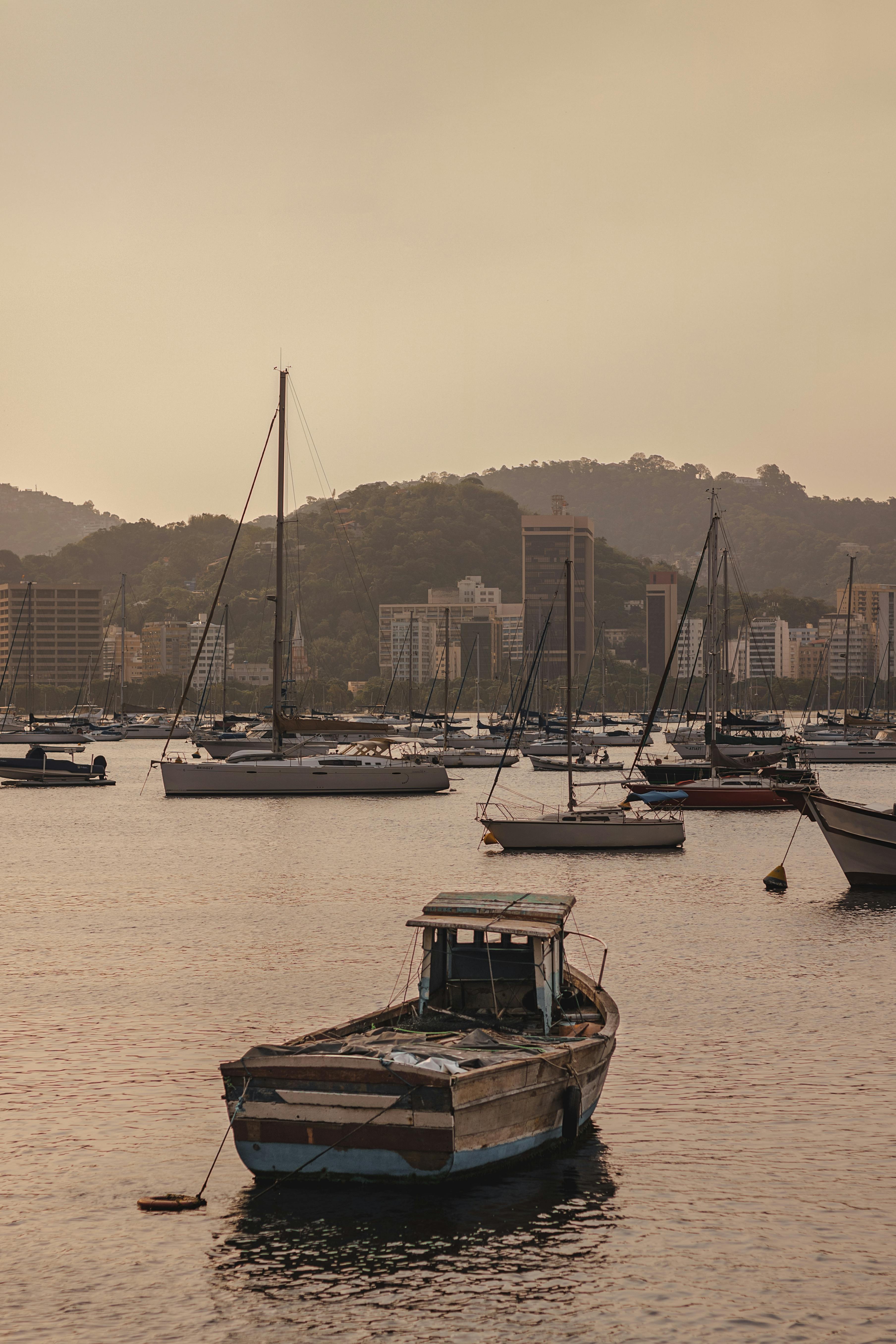 Wooden pier corner above calm rippling lake · Free Stock Photo