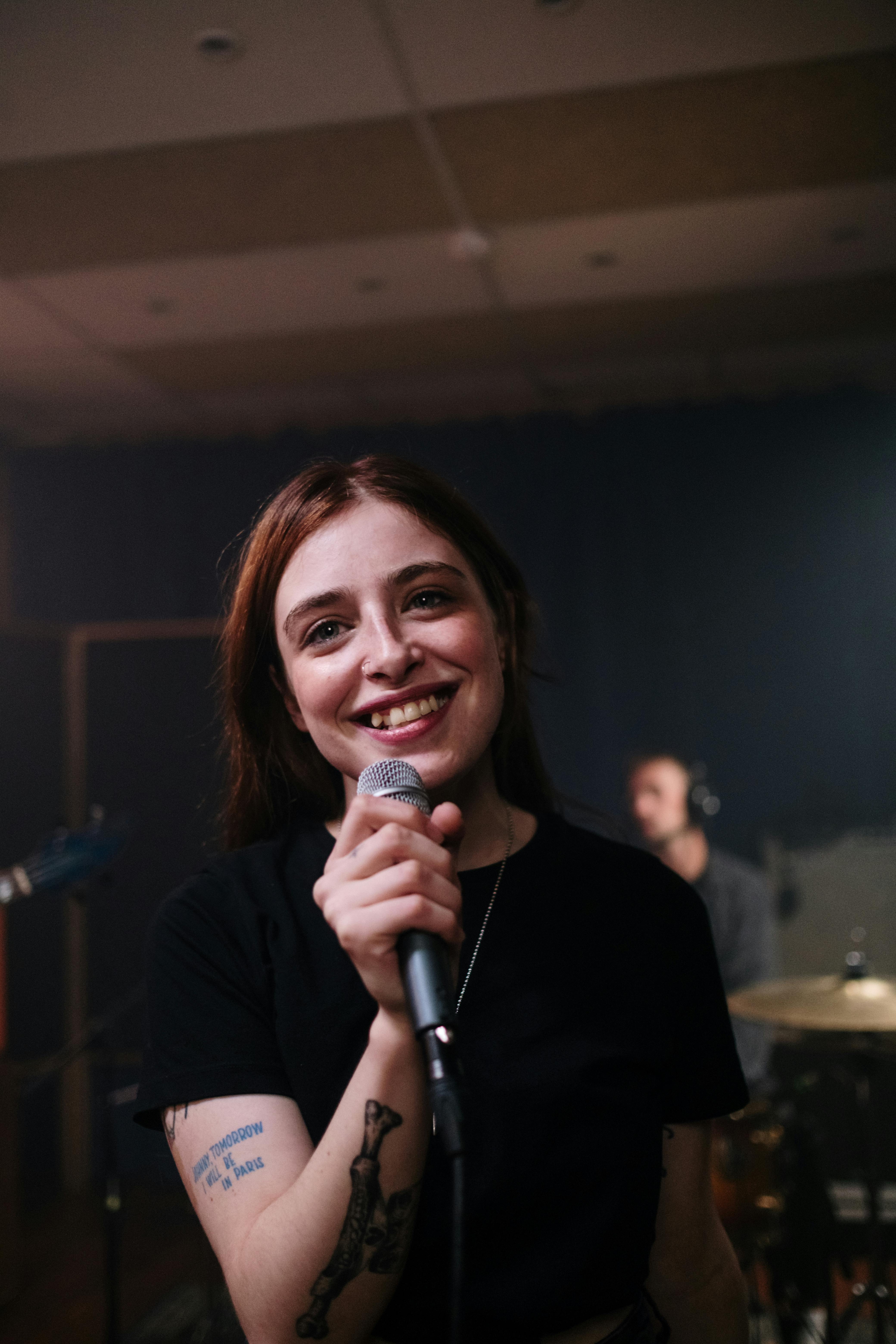 A Woman with a Microphone · Free Stock Photo