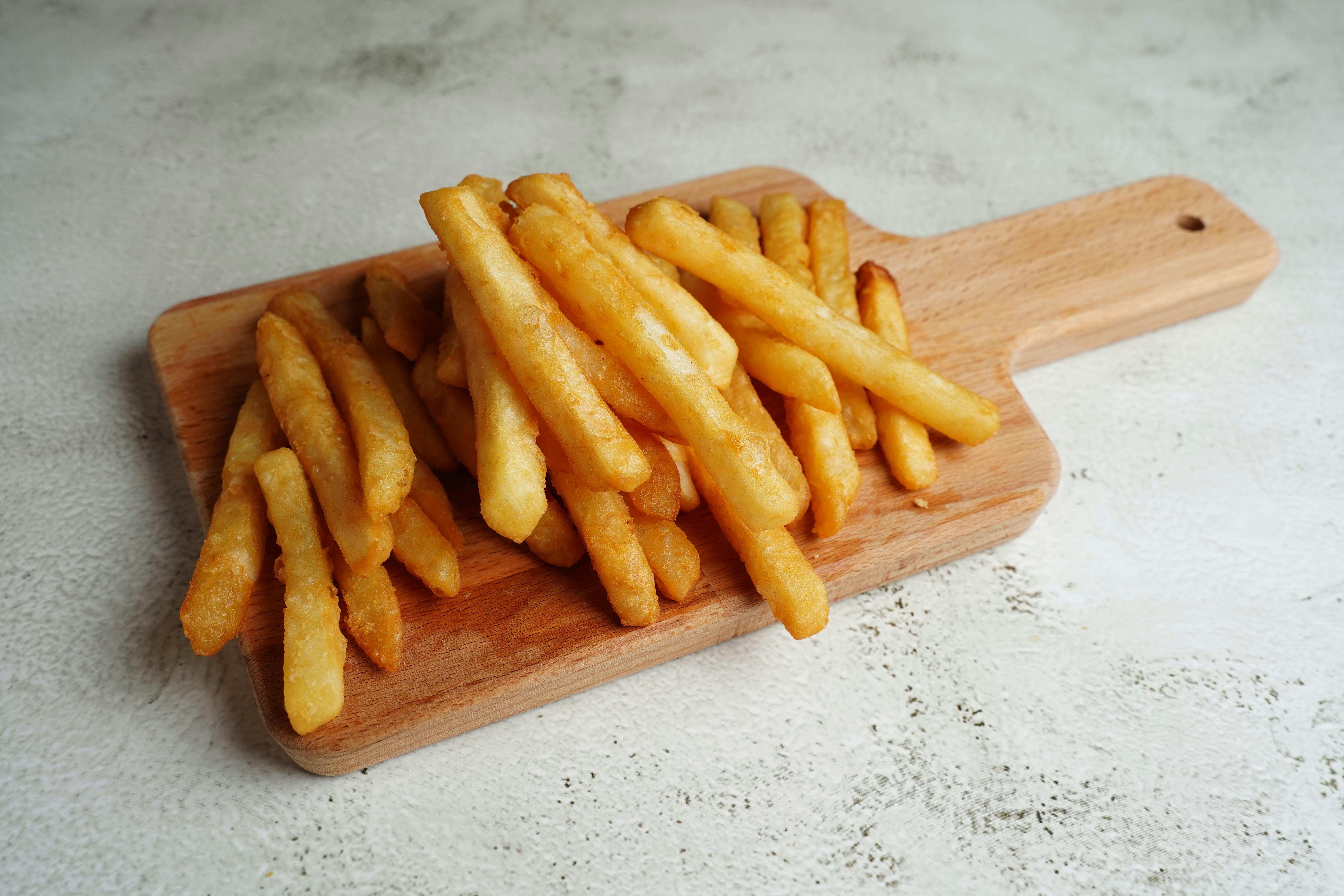 French Fries on Cutting Board · Free Stock Photo