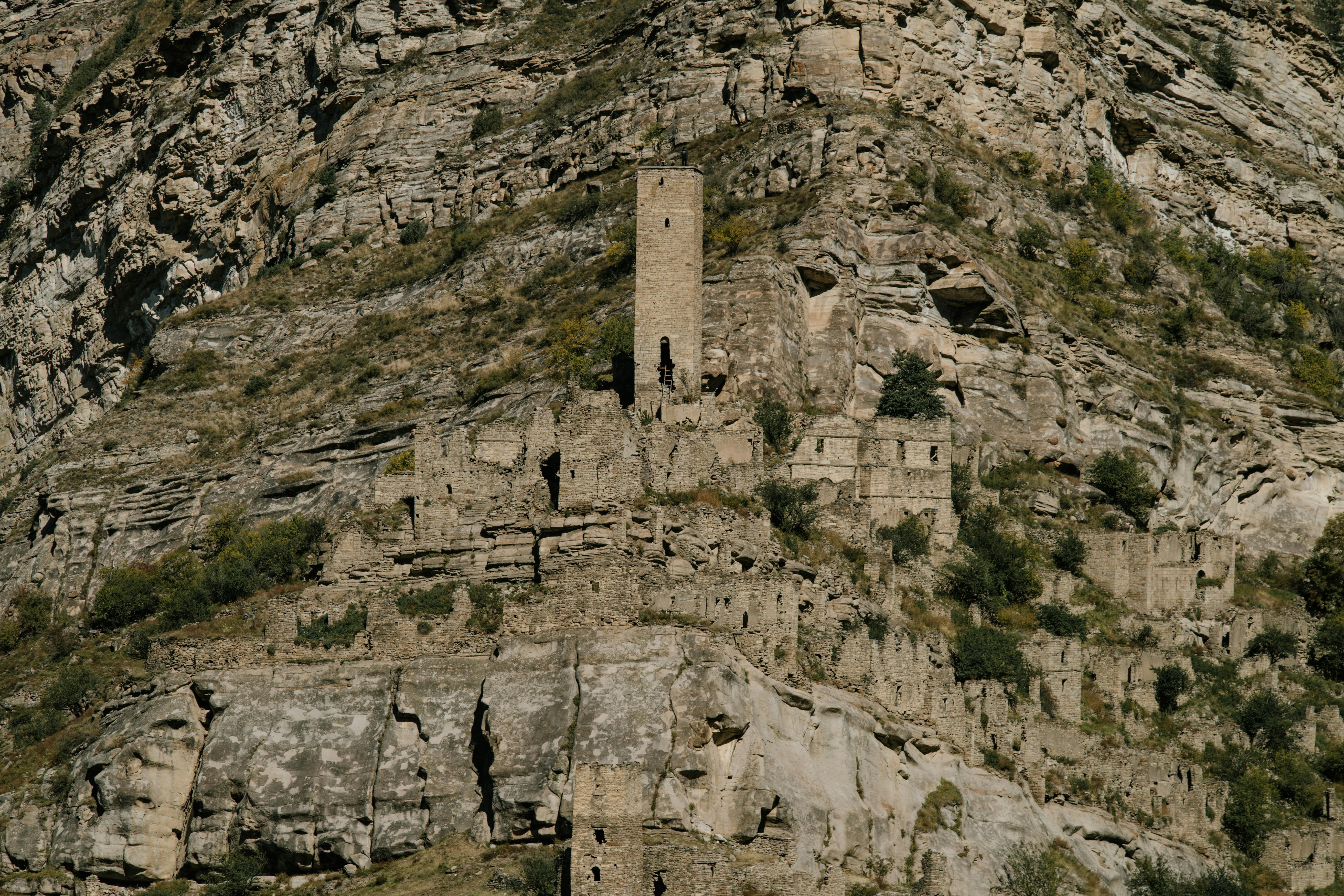 Abandoned Brick Building Ruins Along a Rocky Mountain Cliff · Free ...