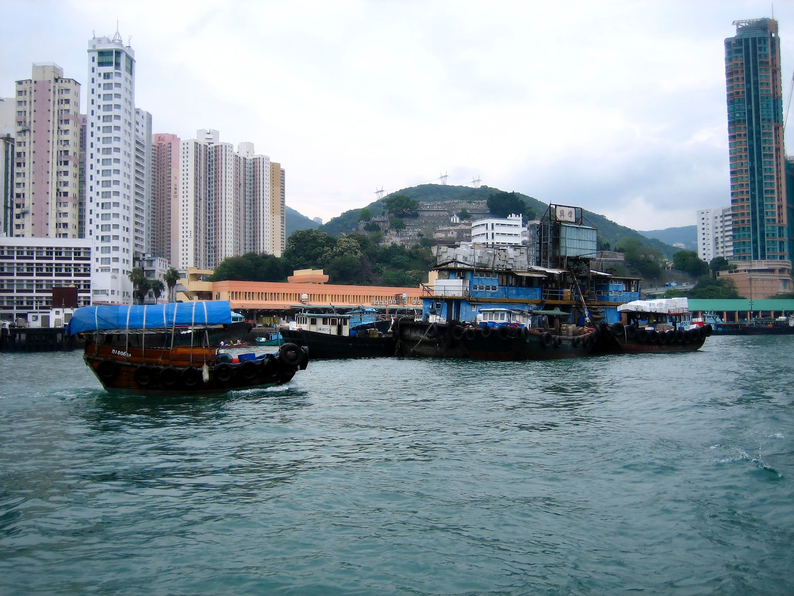 Boat On The Water Near Buildings · Free Stock Photo