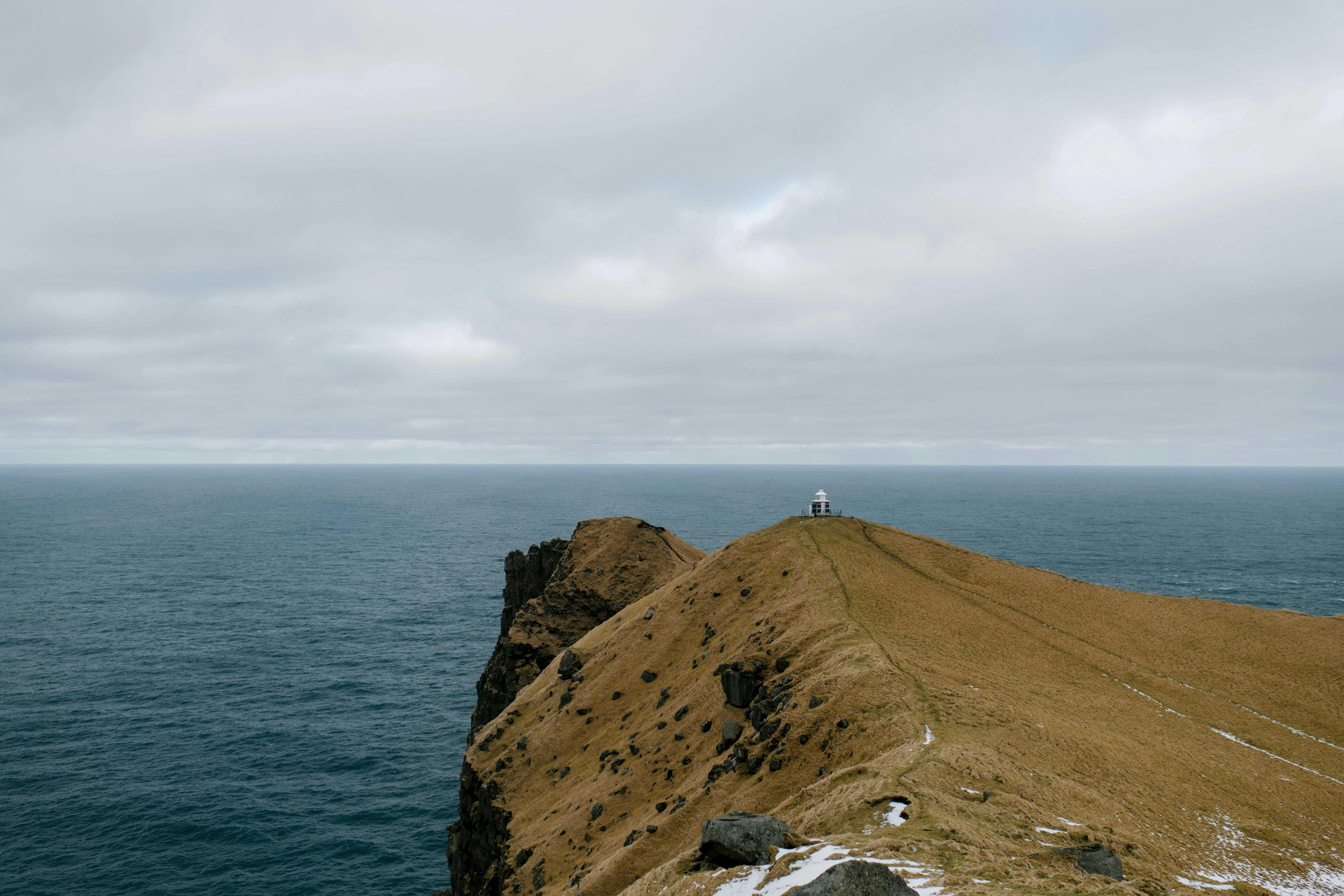 High Cliff with a Building on the Edge · Free Stock Photo