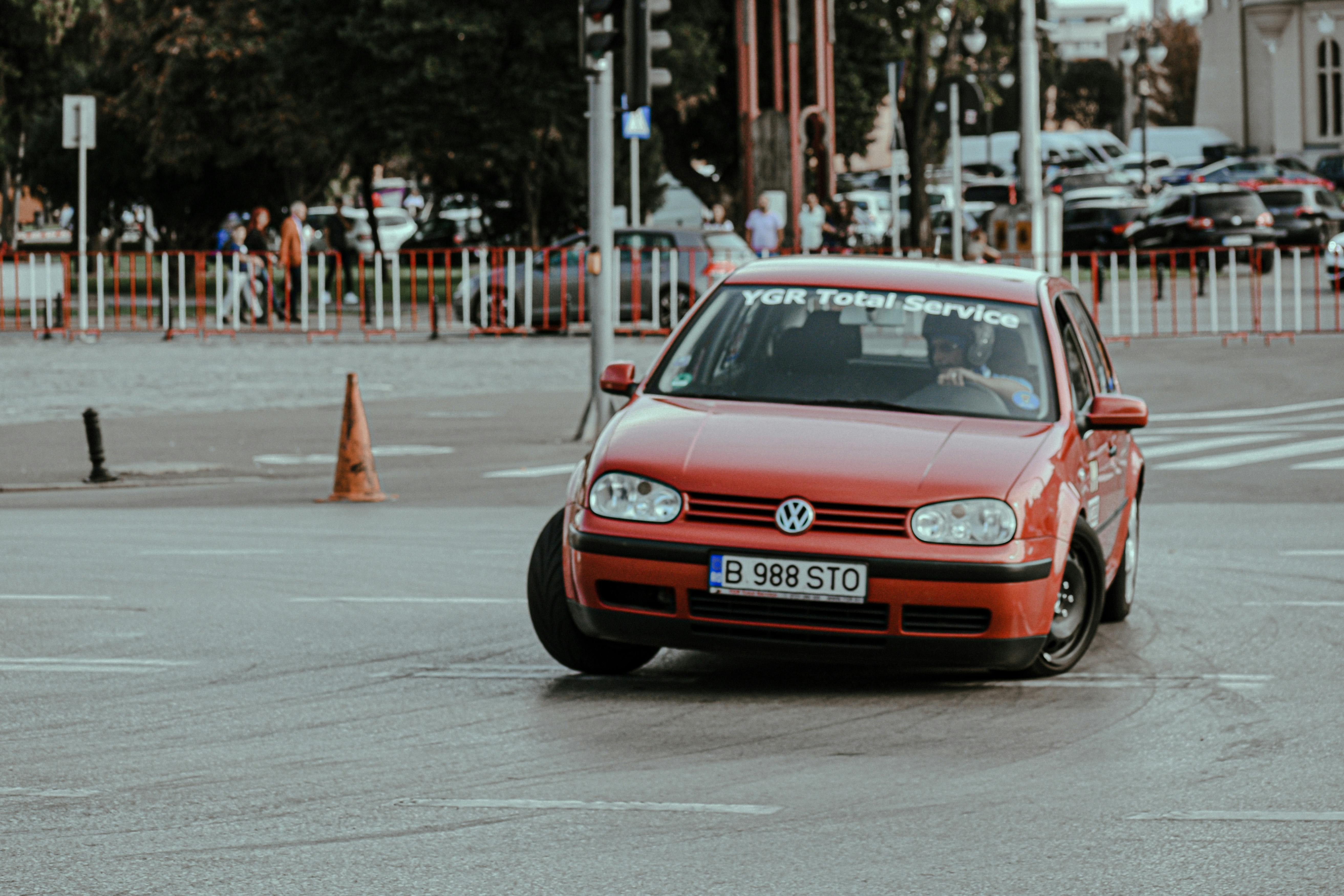 Racing car driving fast on road · Free Stock Photo