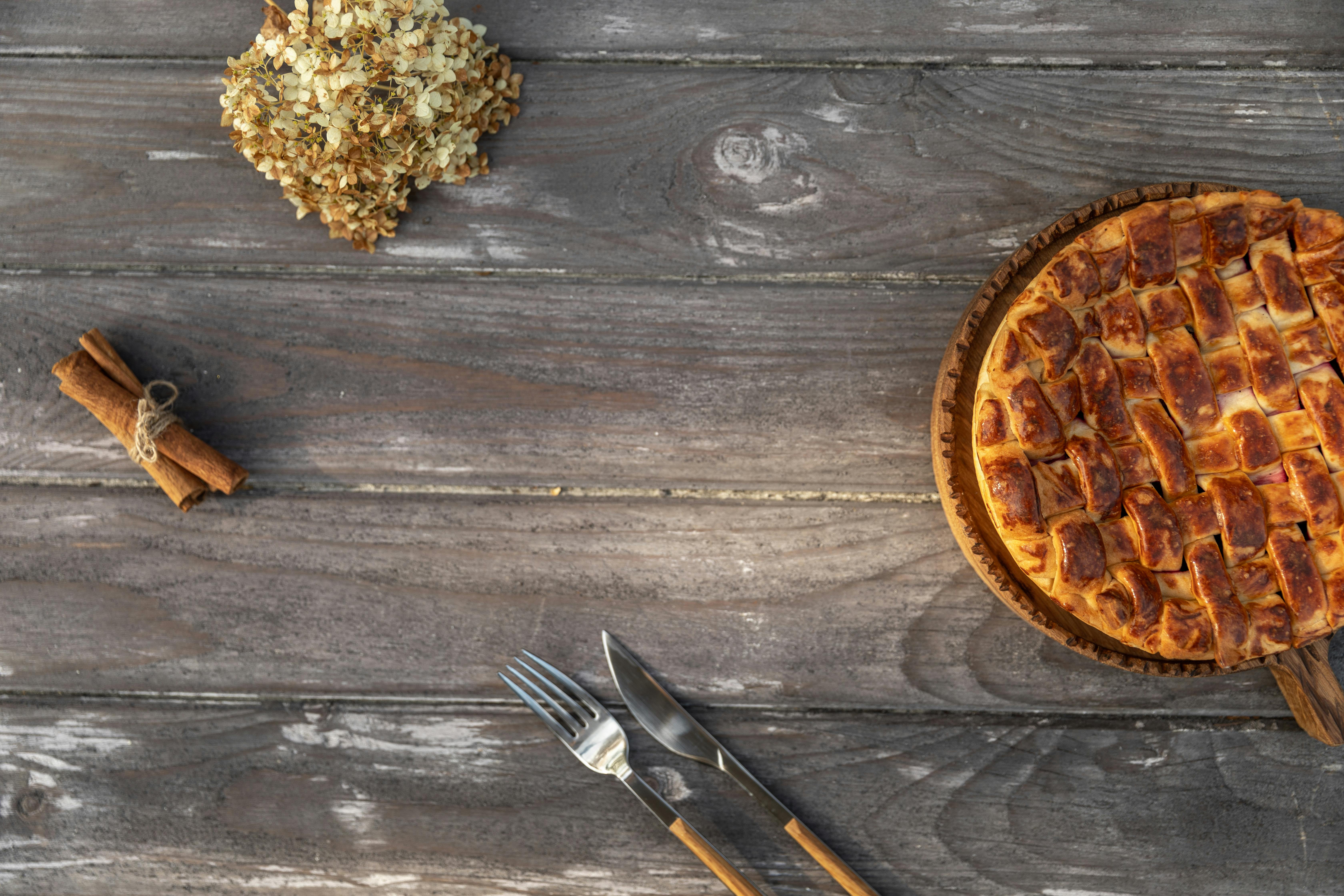 Rustic Pie and Cinnamon on Table · Free Stock Photo