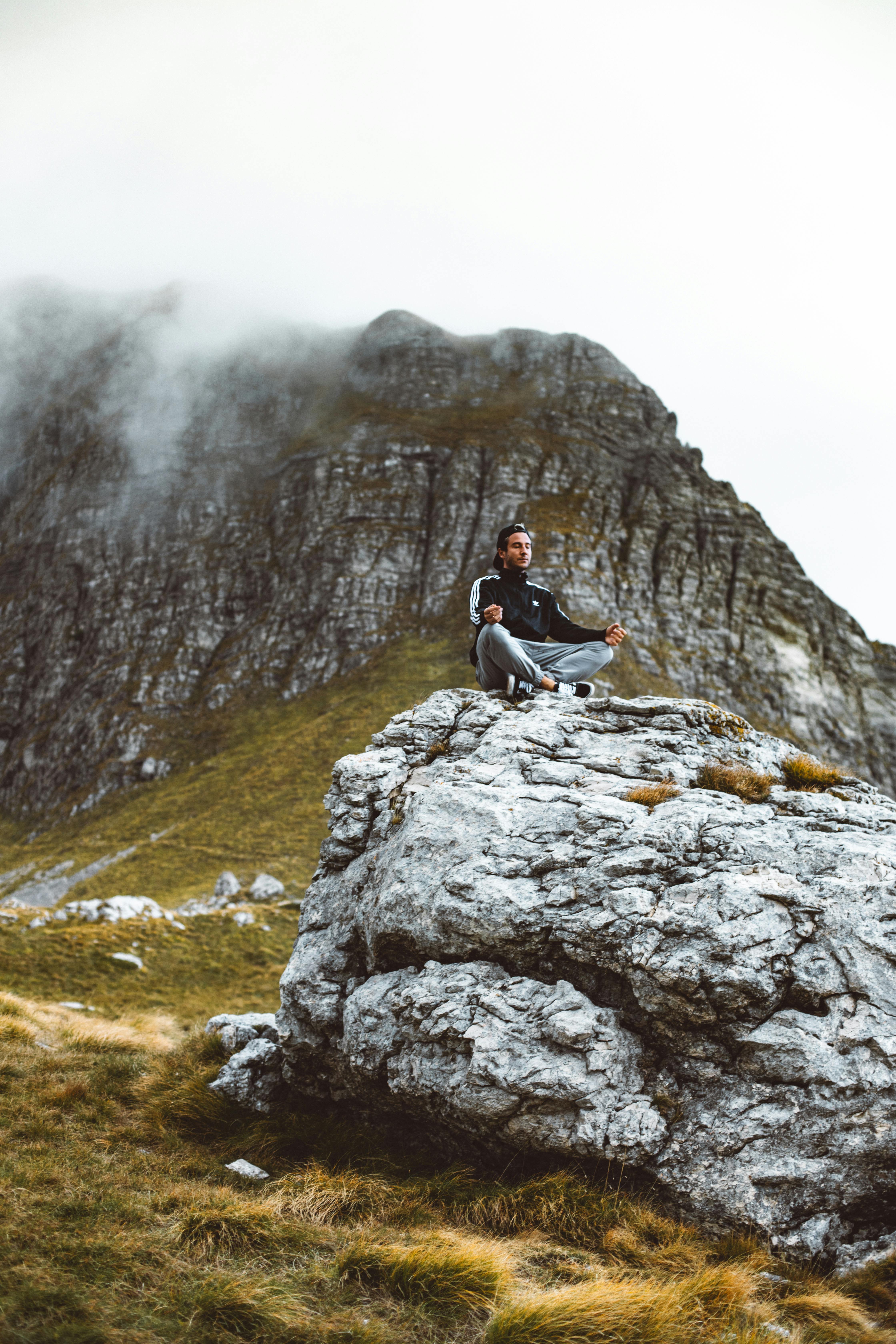 Male Mountain Climber sitting on a Boulder · Free Stock Photo