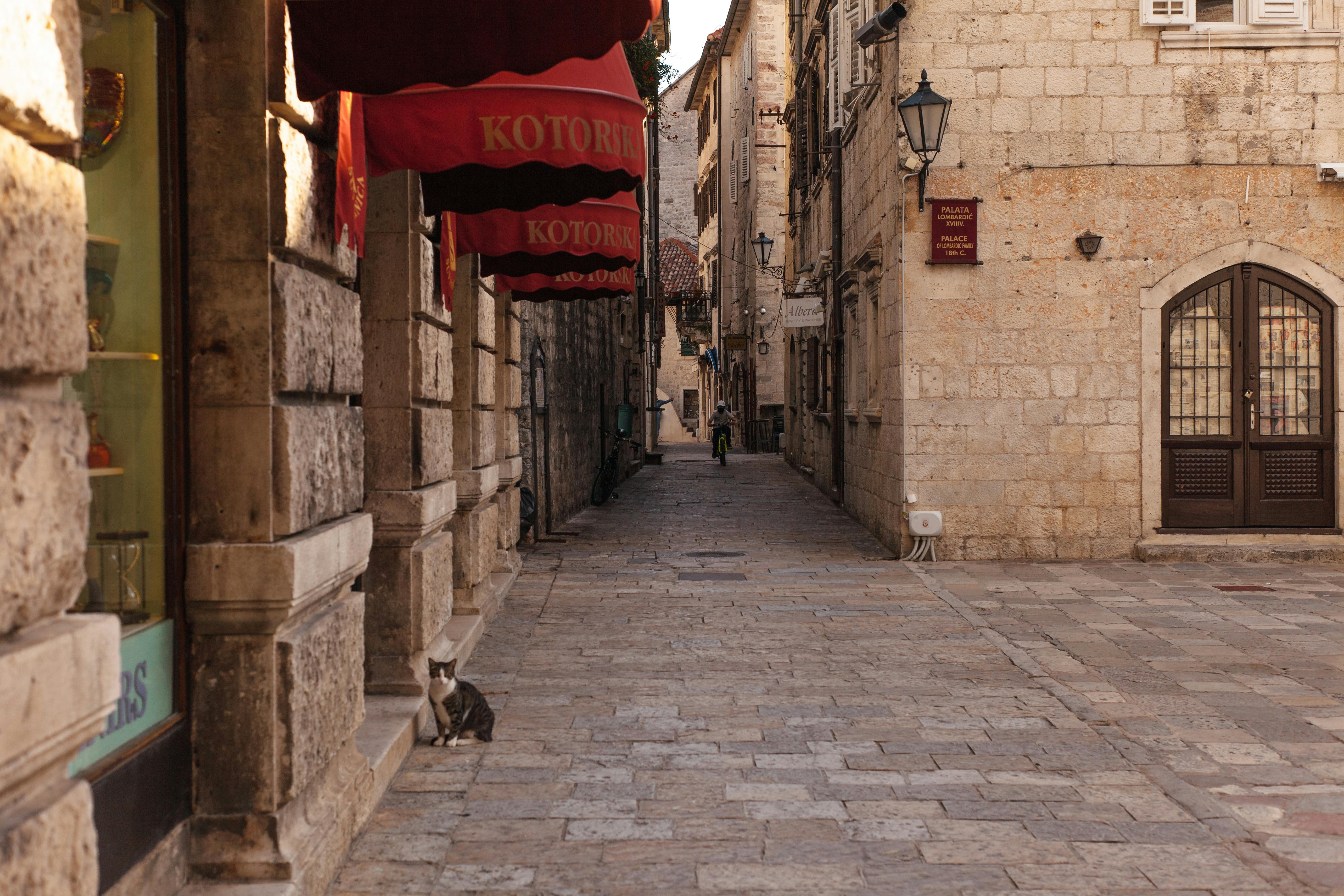 Street in between Brick Buildings · Free Stock Photo