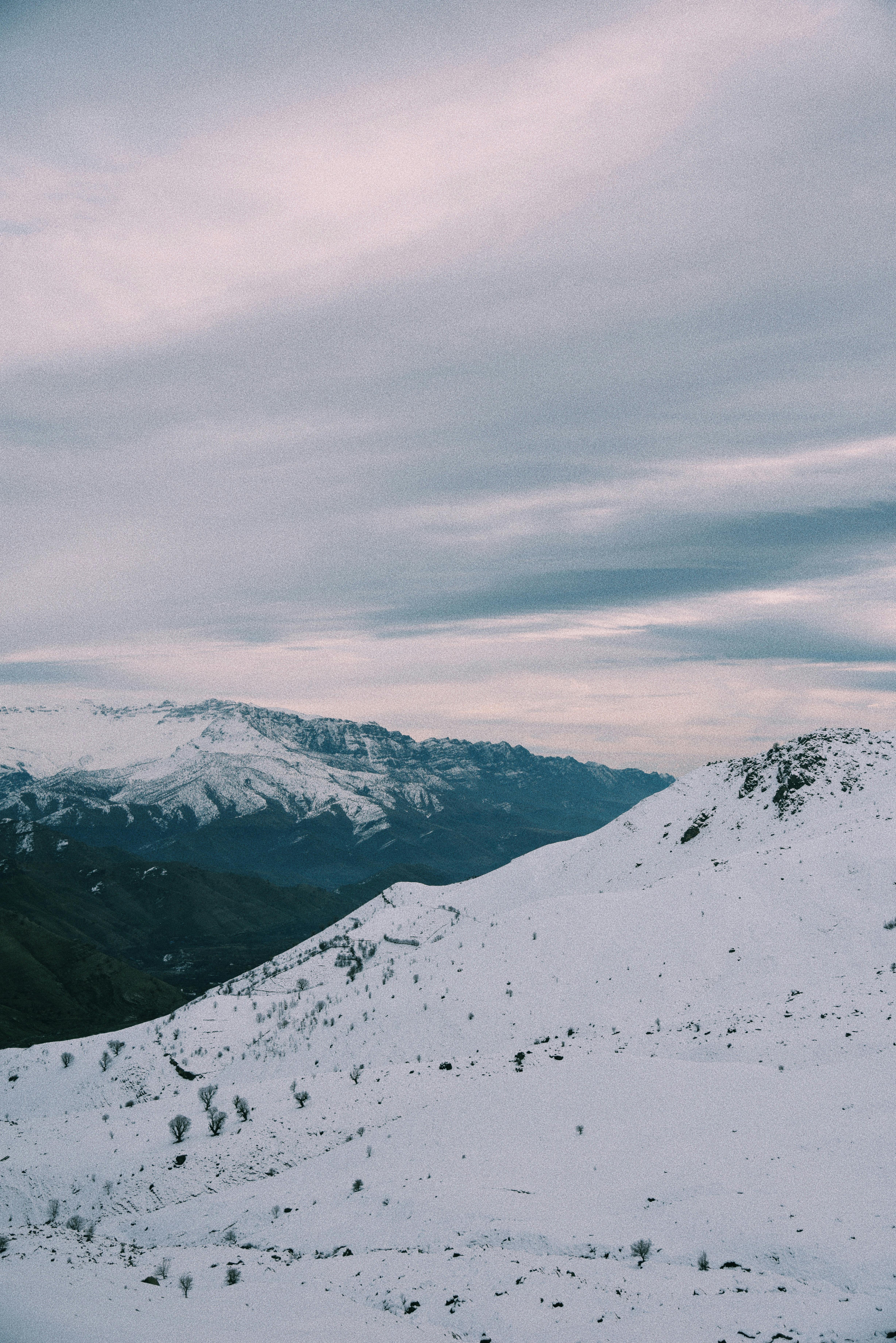 Snowy mountain ridge in winter day · Free Stock Photo