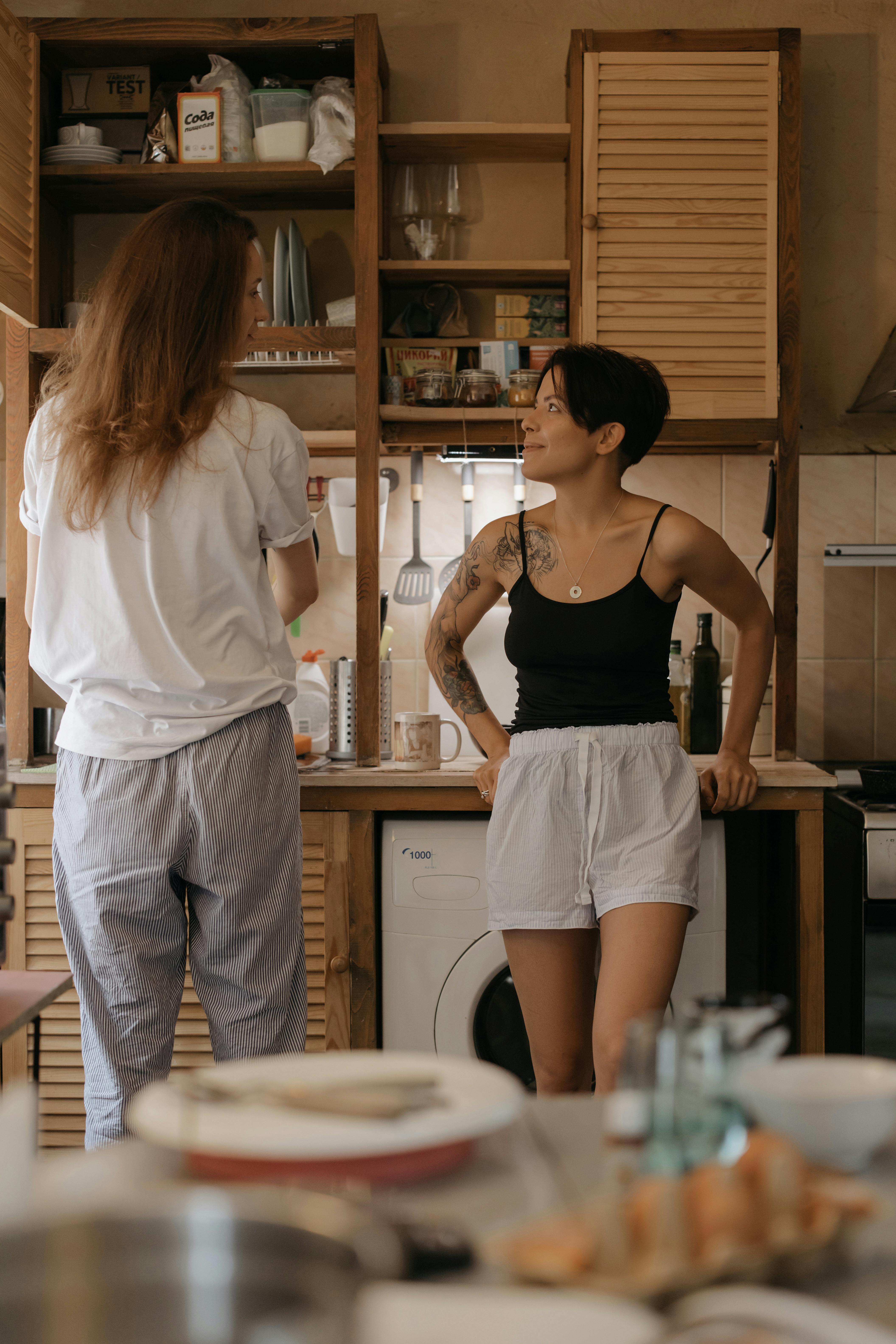 Women in the Kitchen Having a Conversation · Free Stock Photo