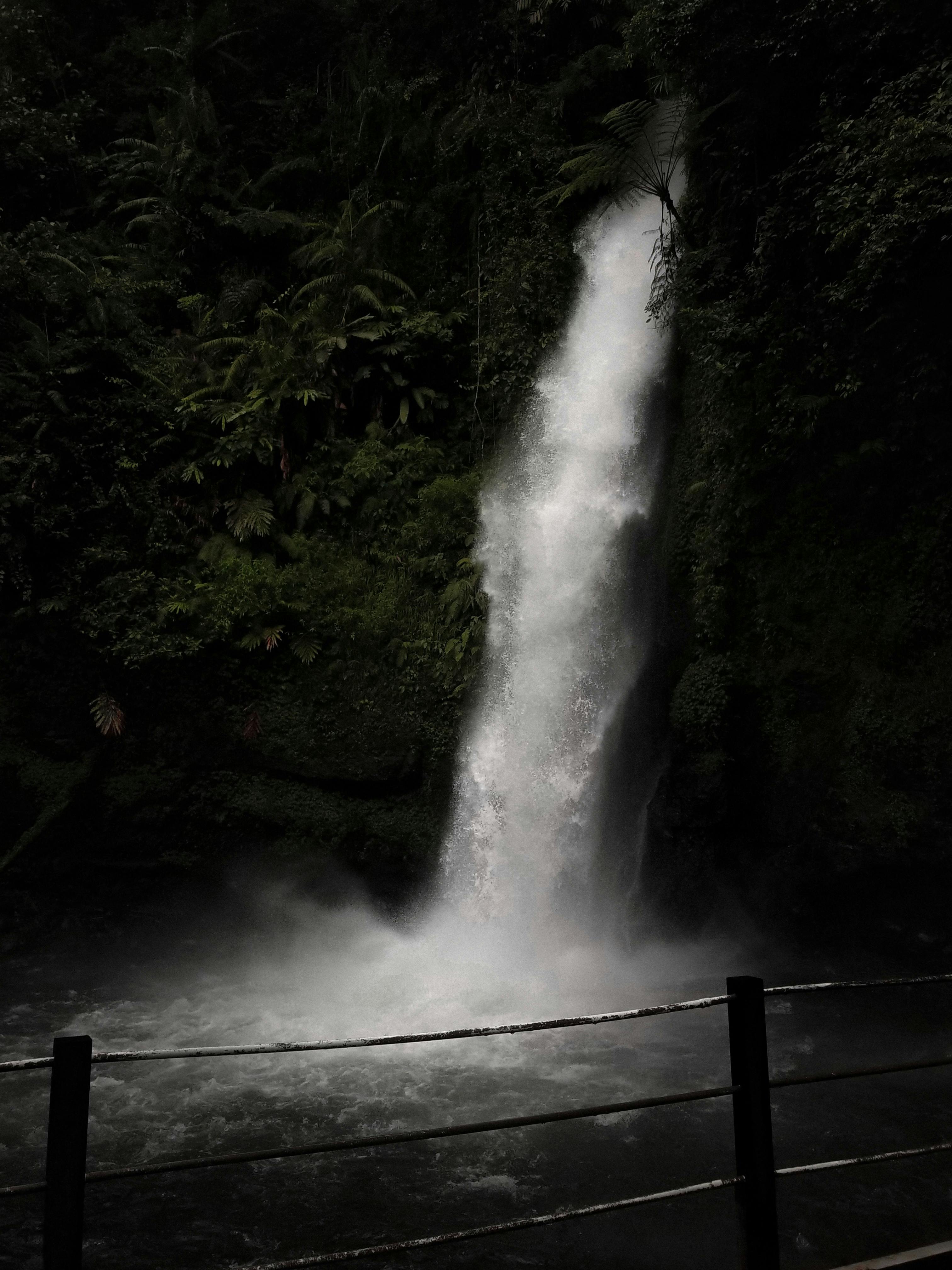Amazing waterfall behind bridge in nature · Free Stock Photo
