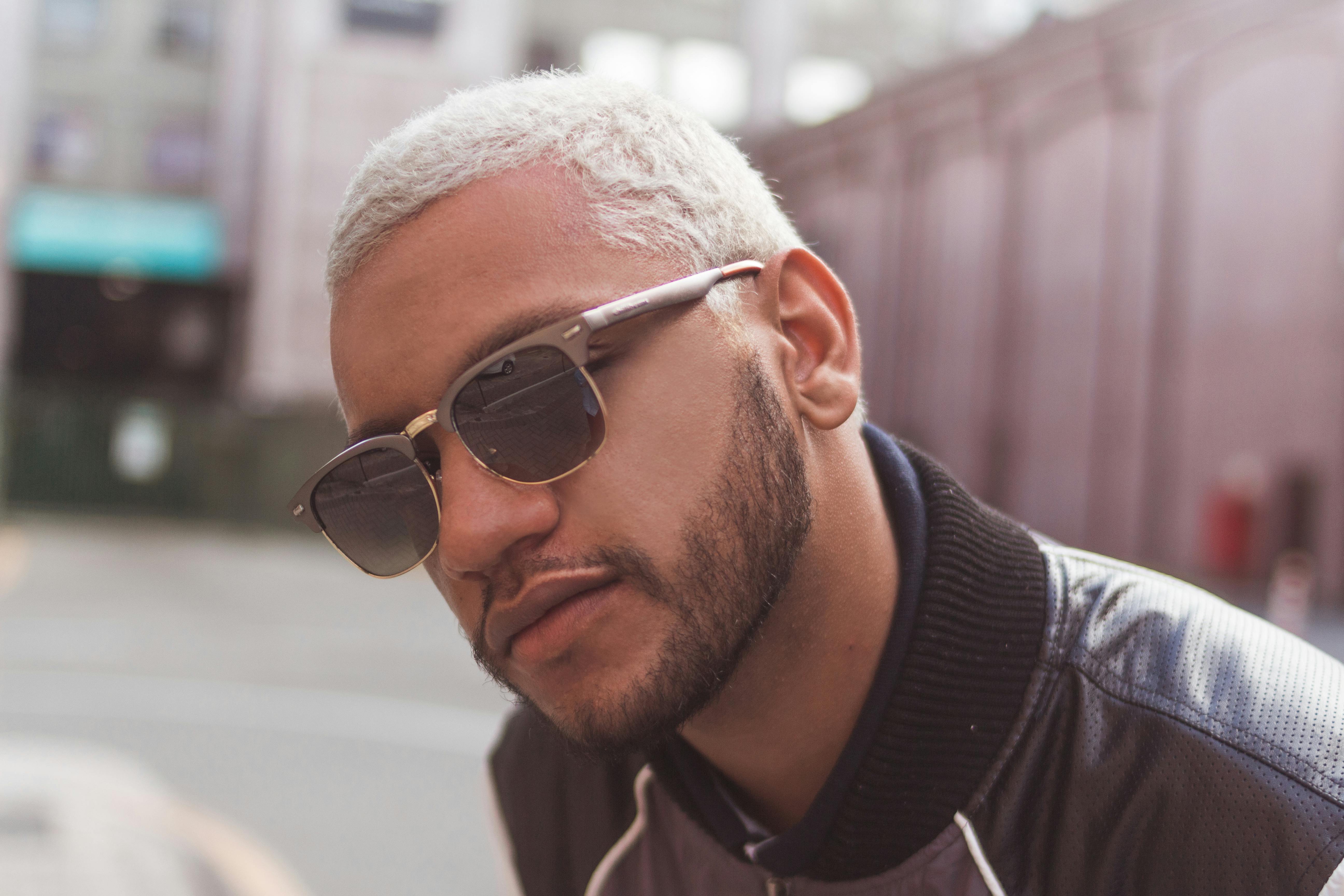 Close-Up Photo of Man Using Headphones · Free Stock Photo