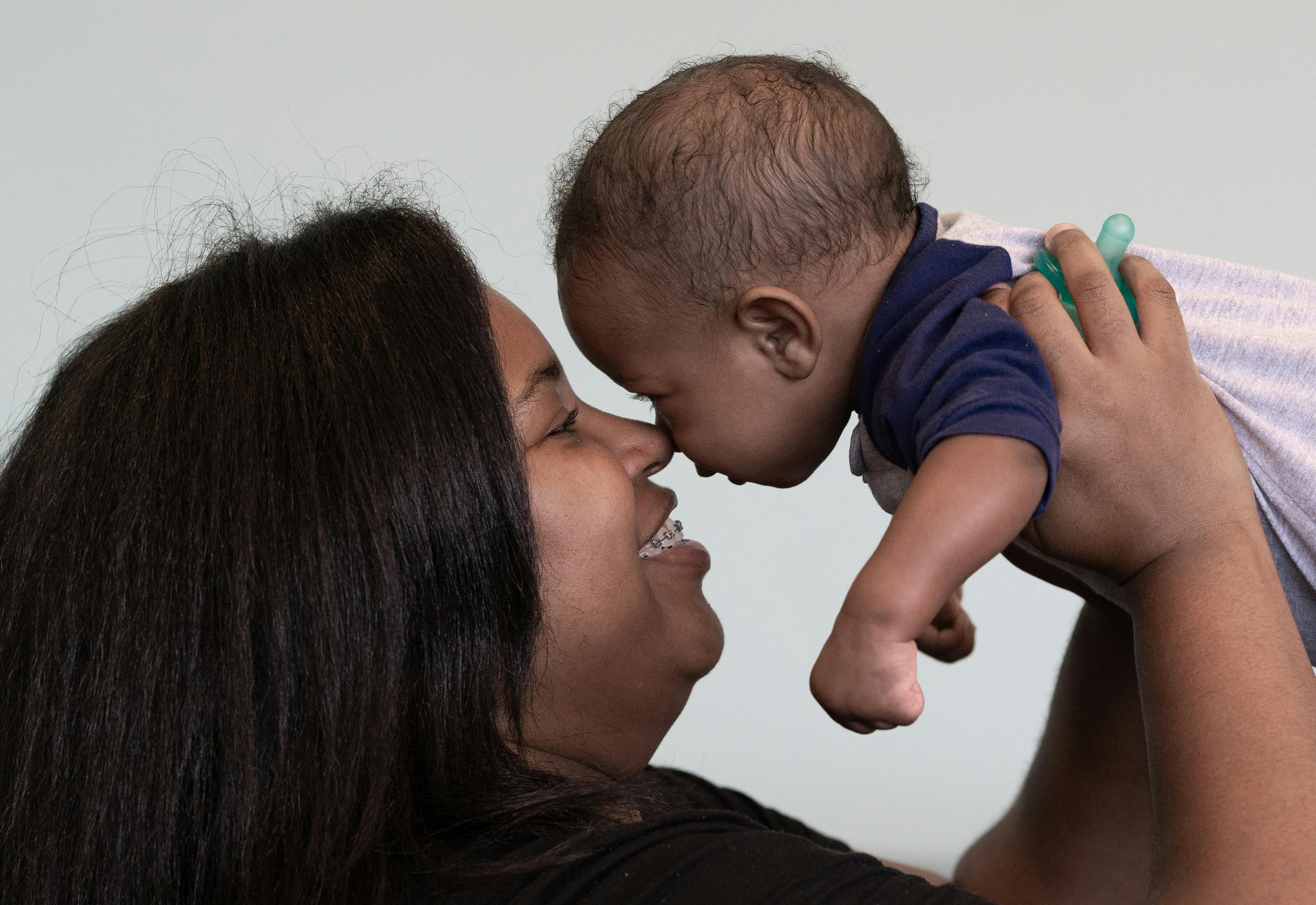 A Volunteer Woman Doing High Five with Children · Free Stock Photo
