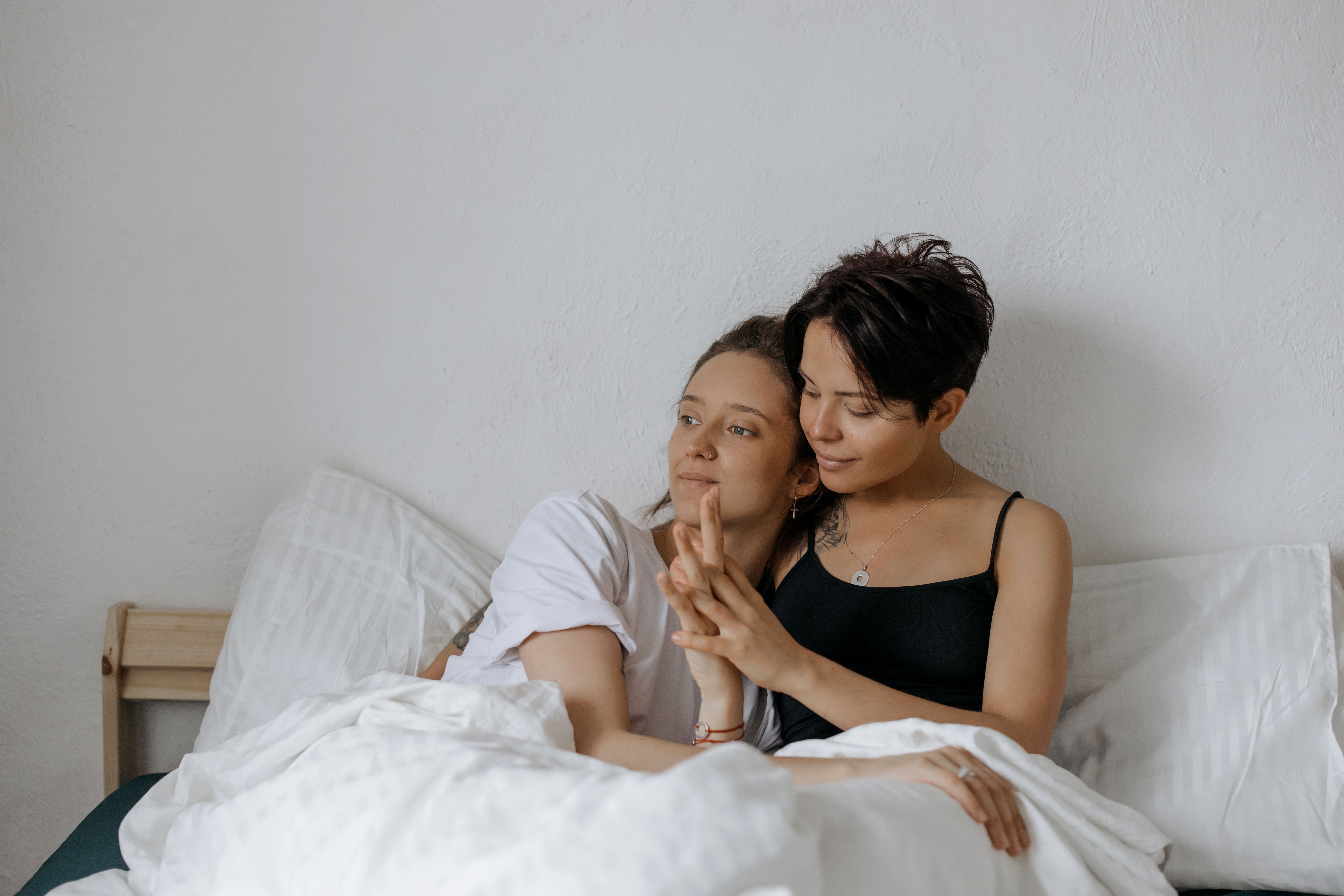 Couple Lying Down and Hugging in Bed · Free Stock Photo