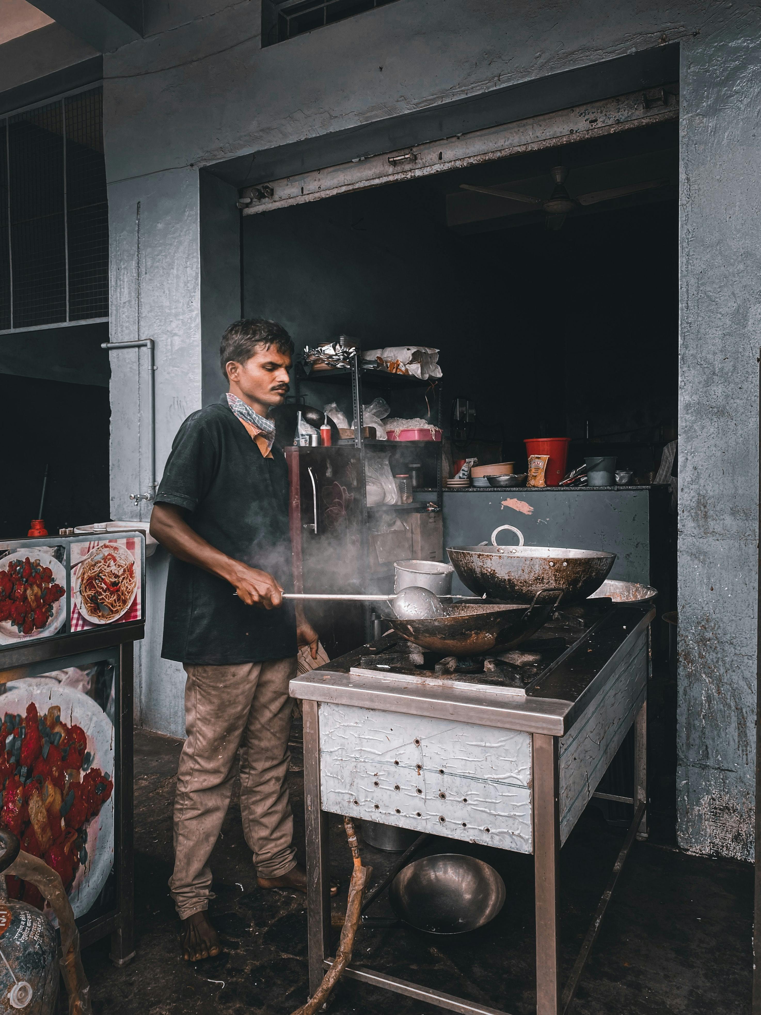 Man Cooking on the Street · Free Stock Photo