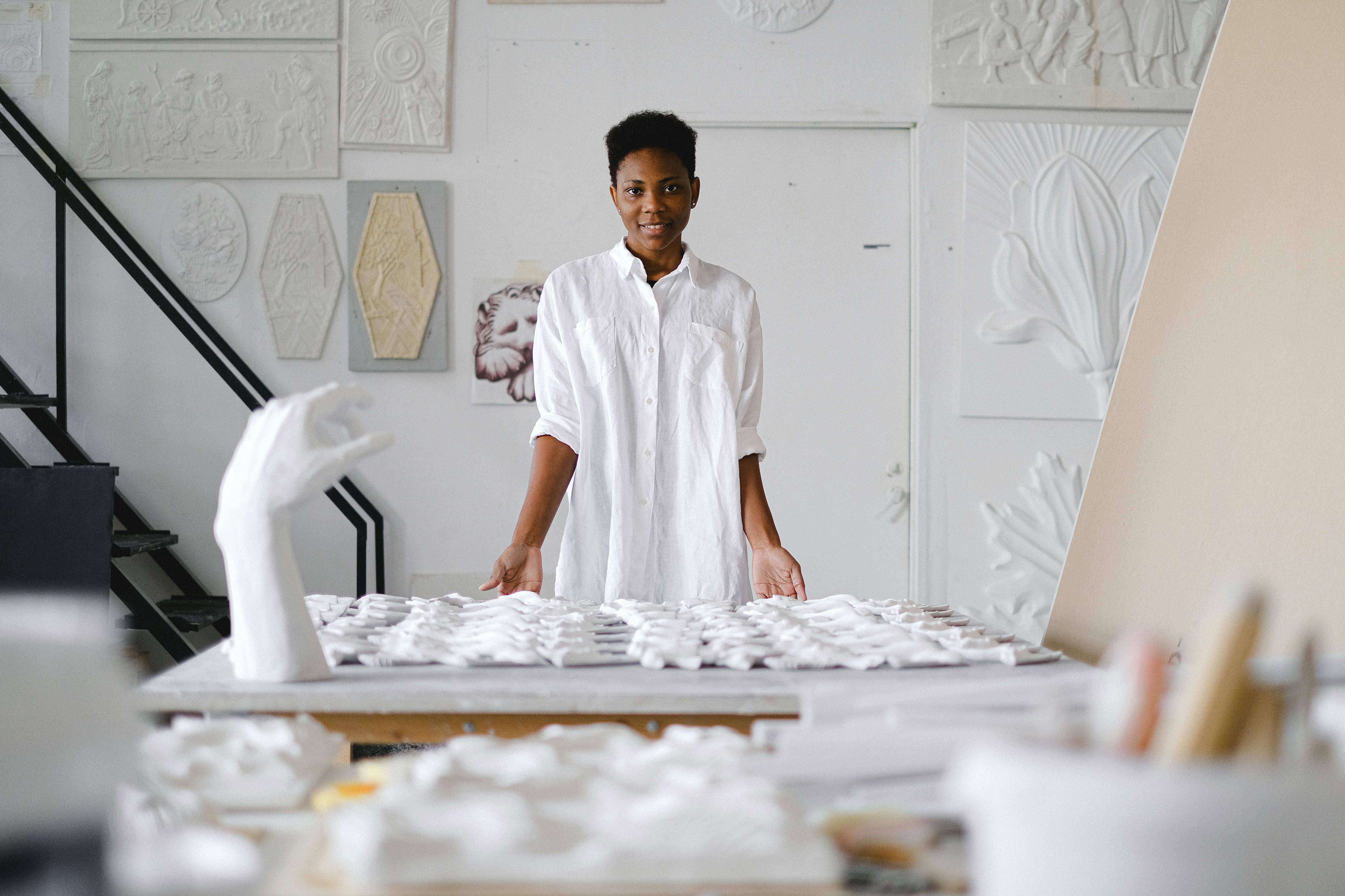 Woman Standing by Table · Free Stock Photo