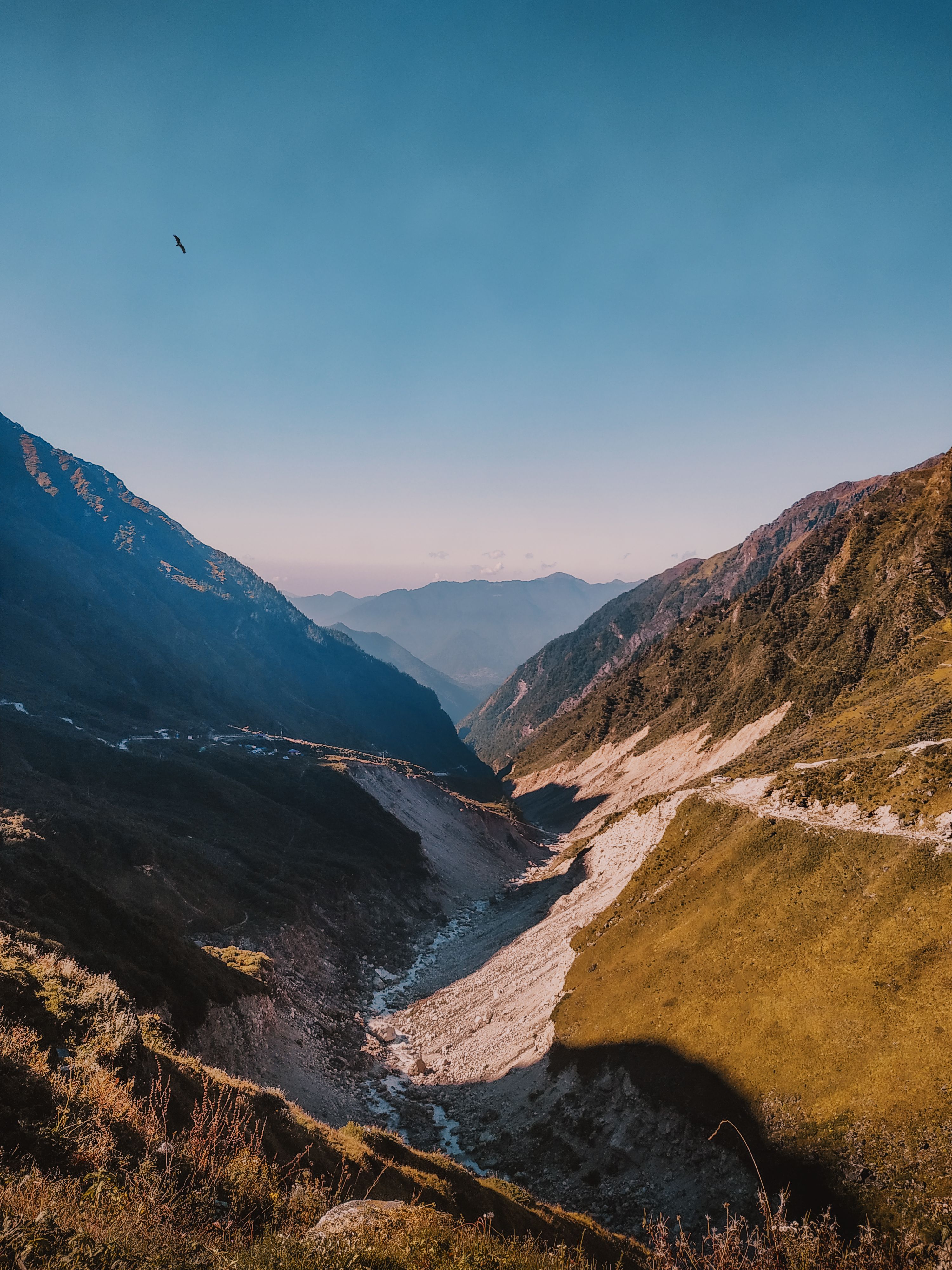 A Creek in the Valley Between Mountains · Free Stock Photo