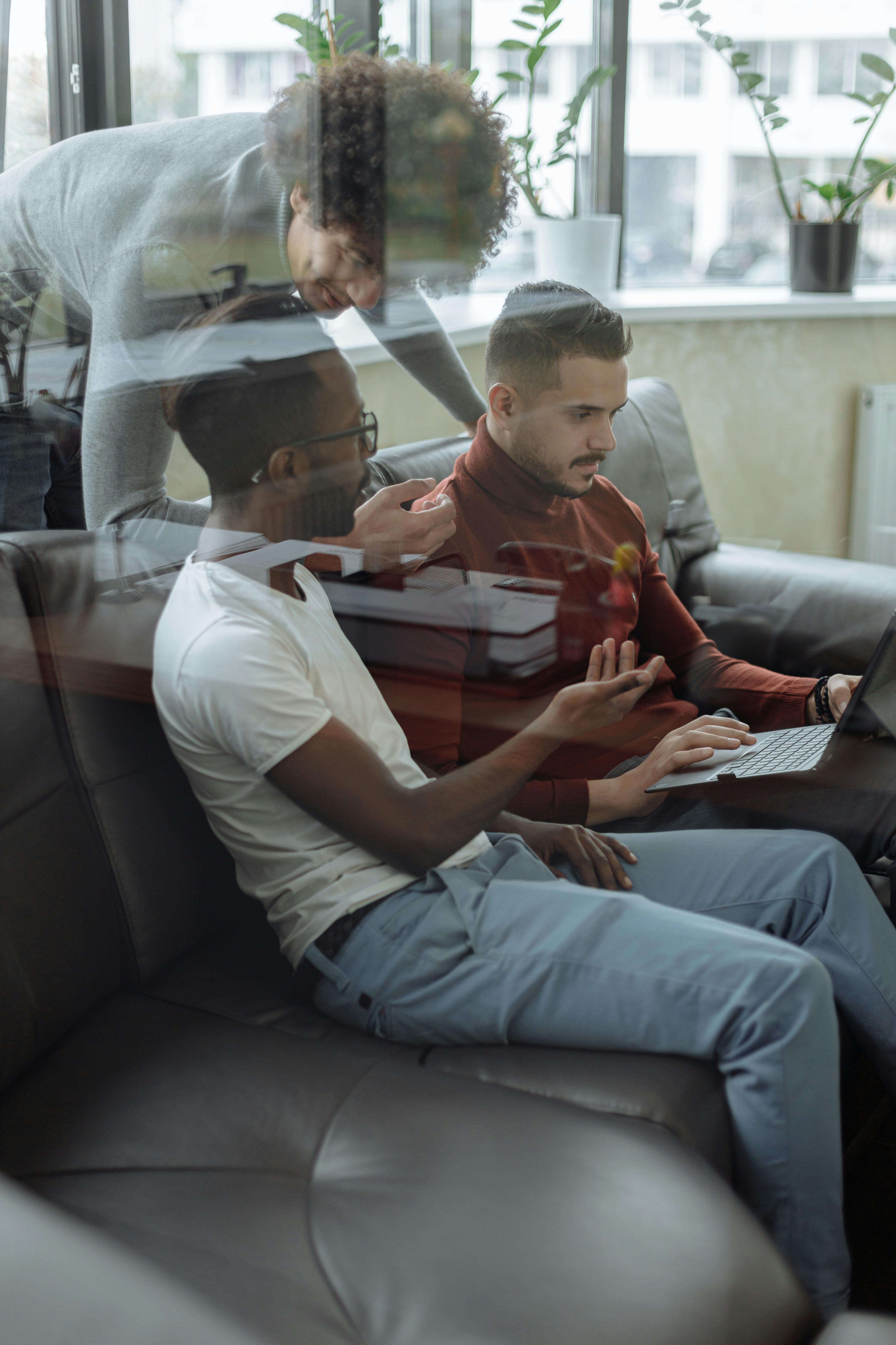 Three Men Sitting at the Table · Free Stock Photo
