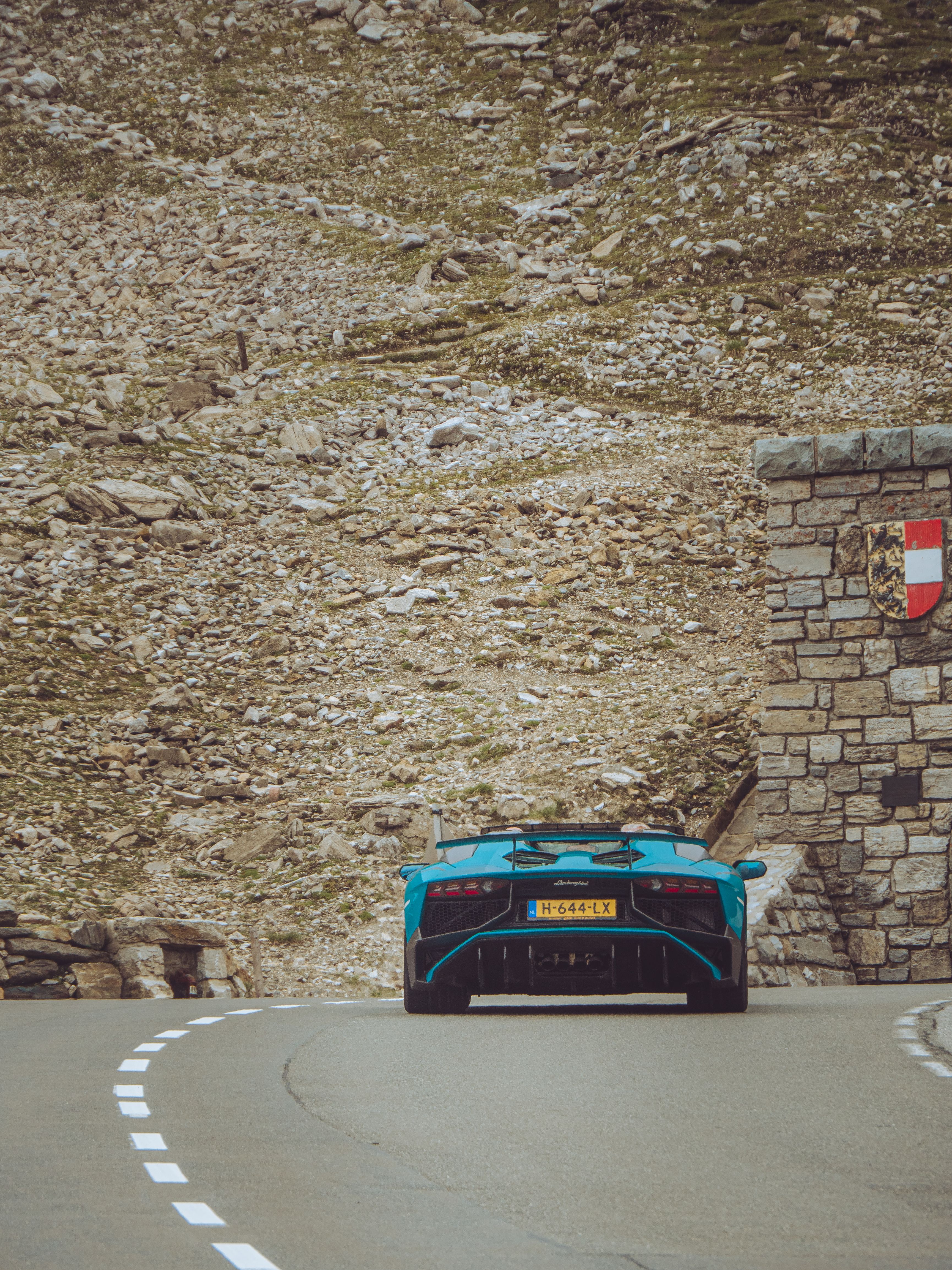 Blue Car on Gray Concrete Road · Free Stock Photo
