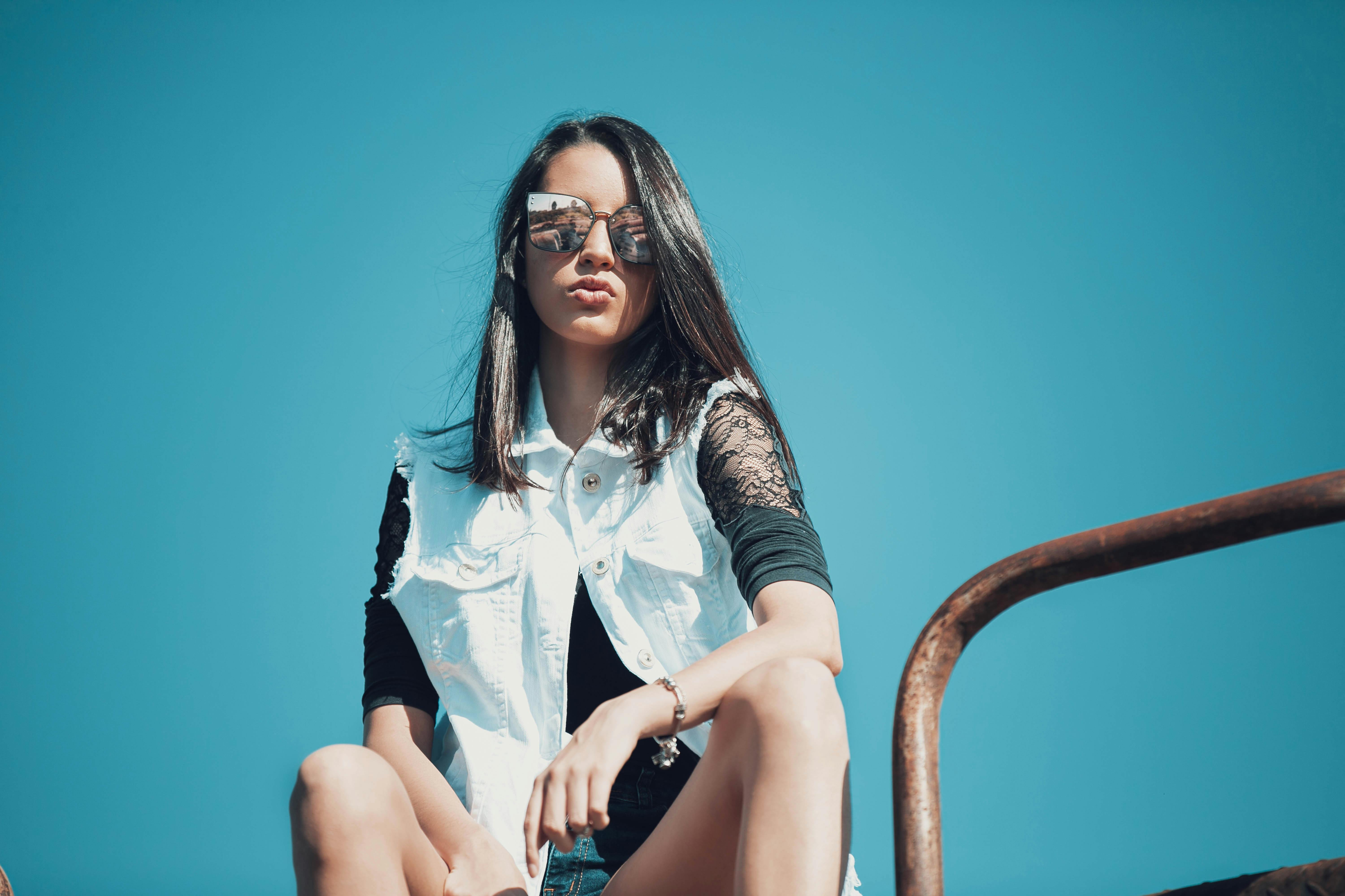 A Girl with Sunglasses Pouting · Free Stock Photo