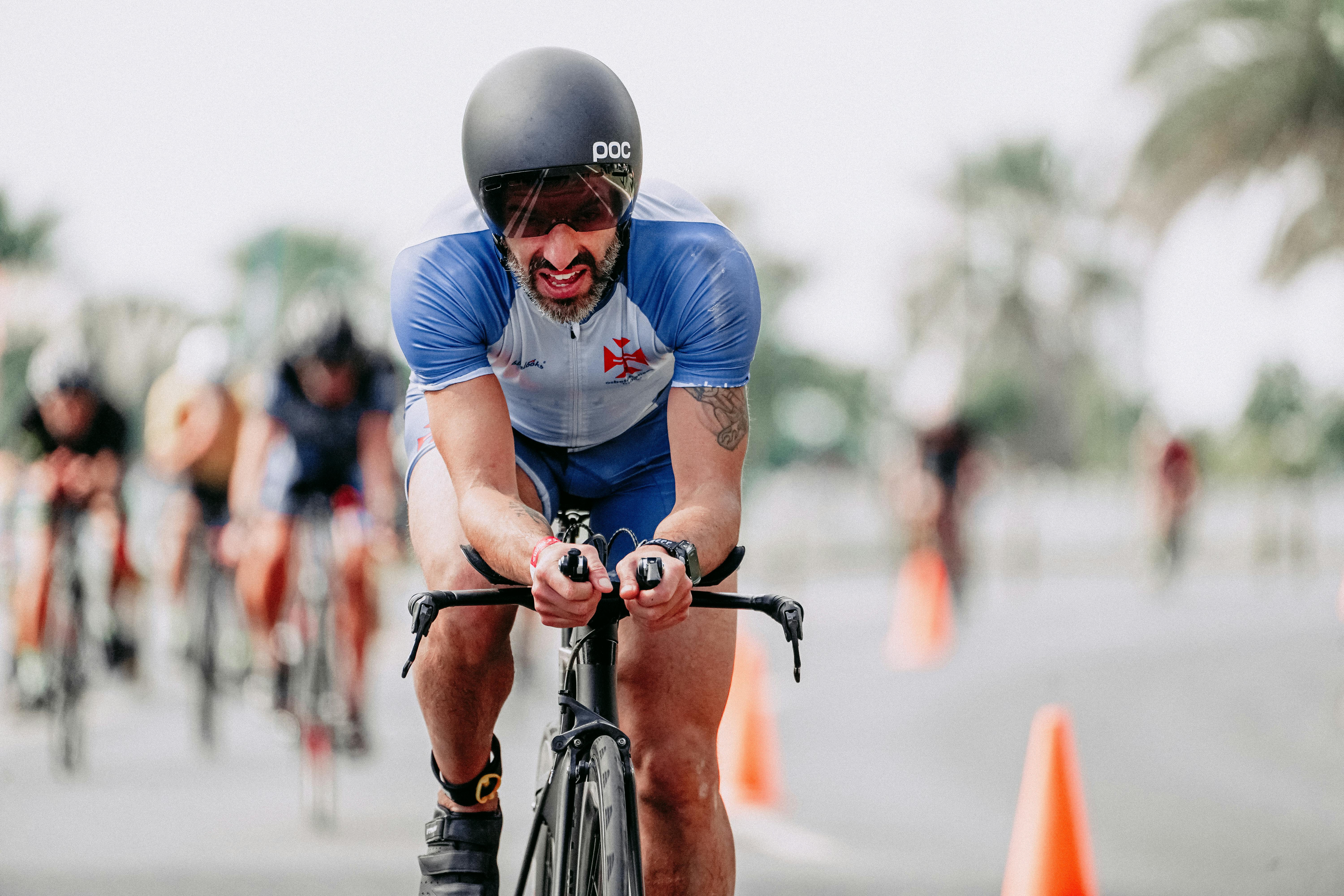 Professional cyclist riding on road race · Free Stock Photo