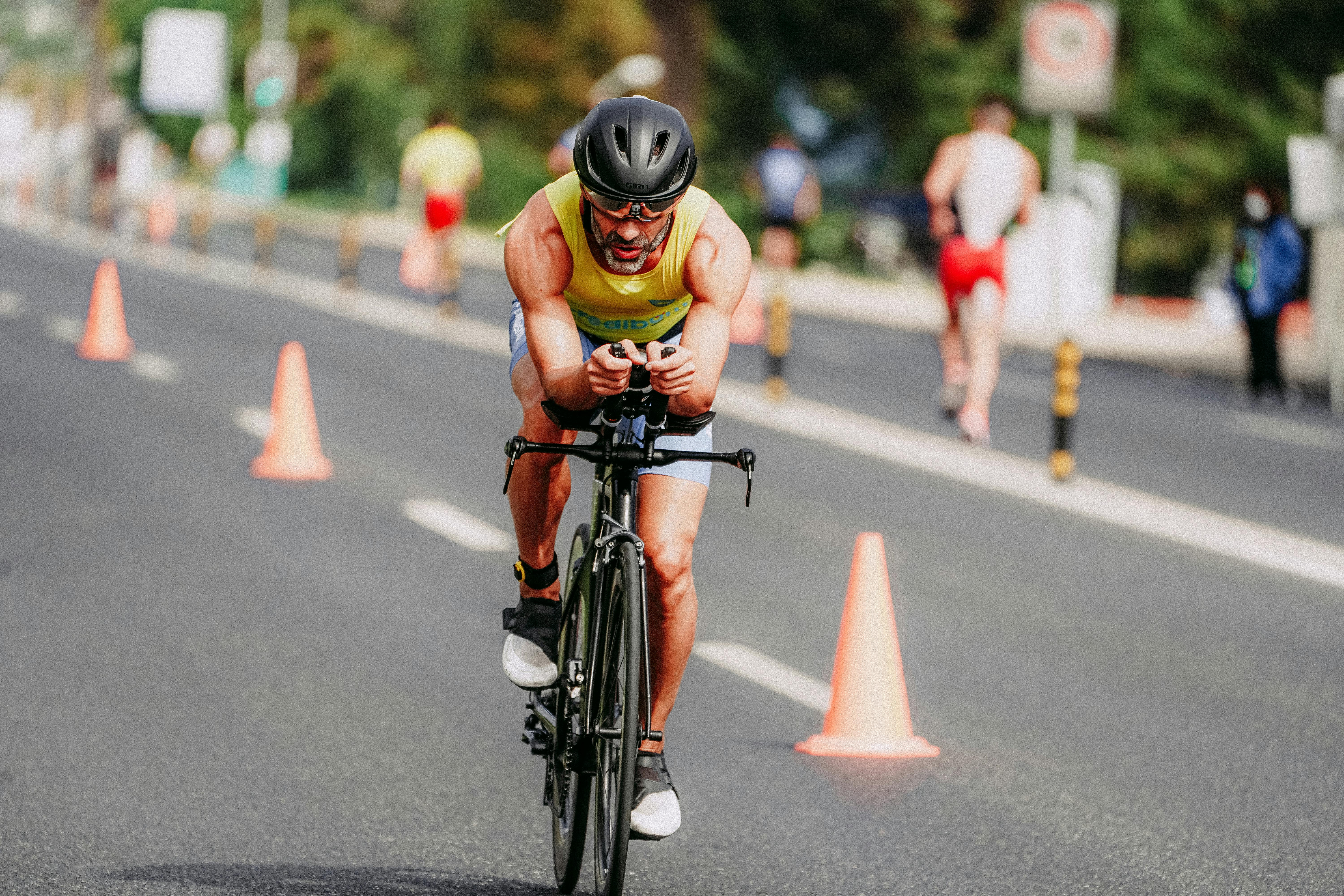 Strong cyclist competing on bicycle on road · Free Stock Photo