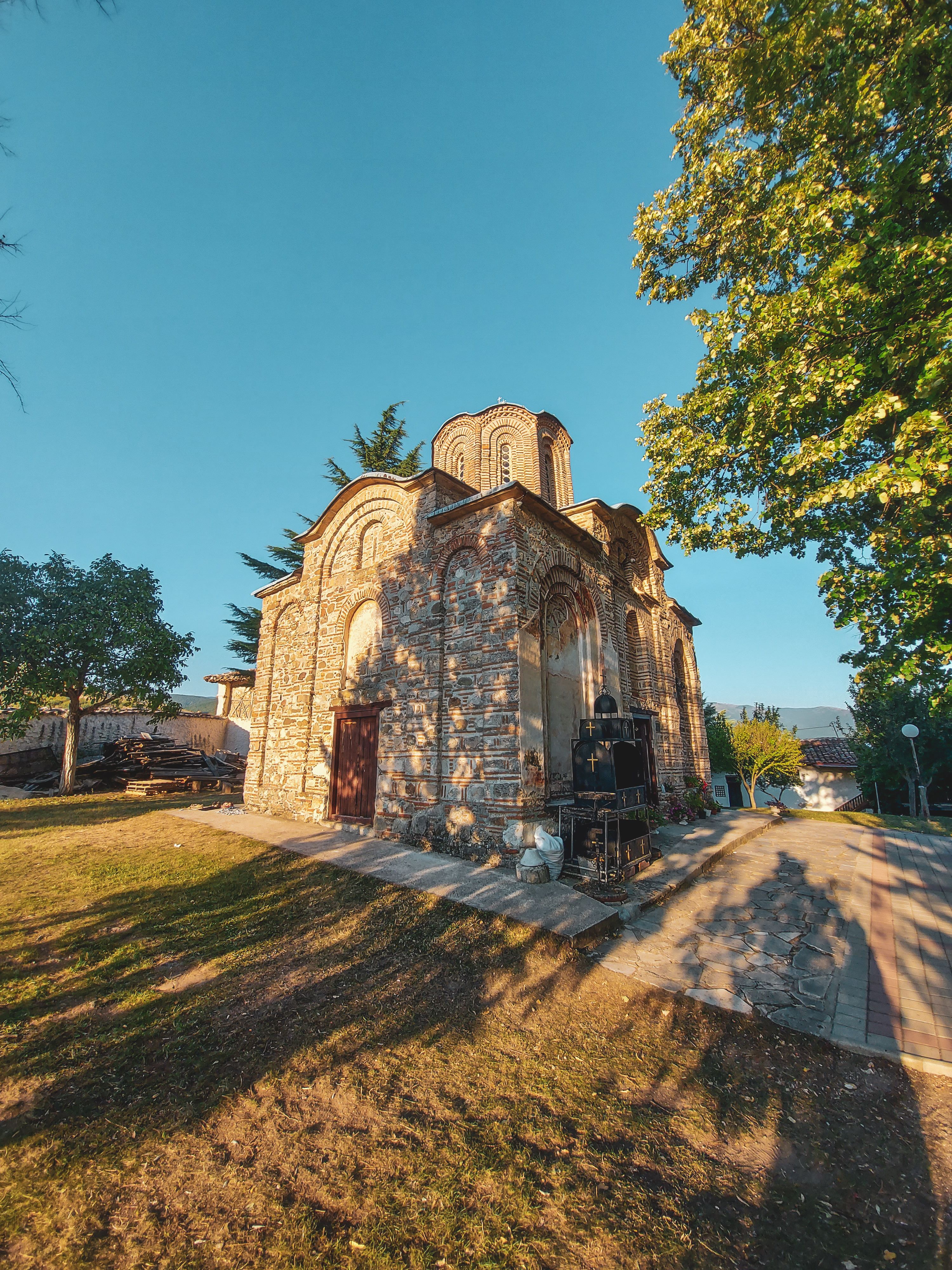 Exterior of old stone church · Free Stock Photo