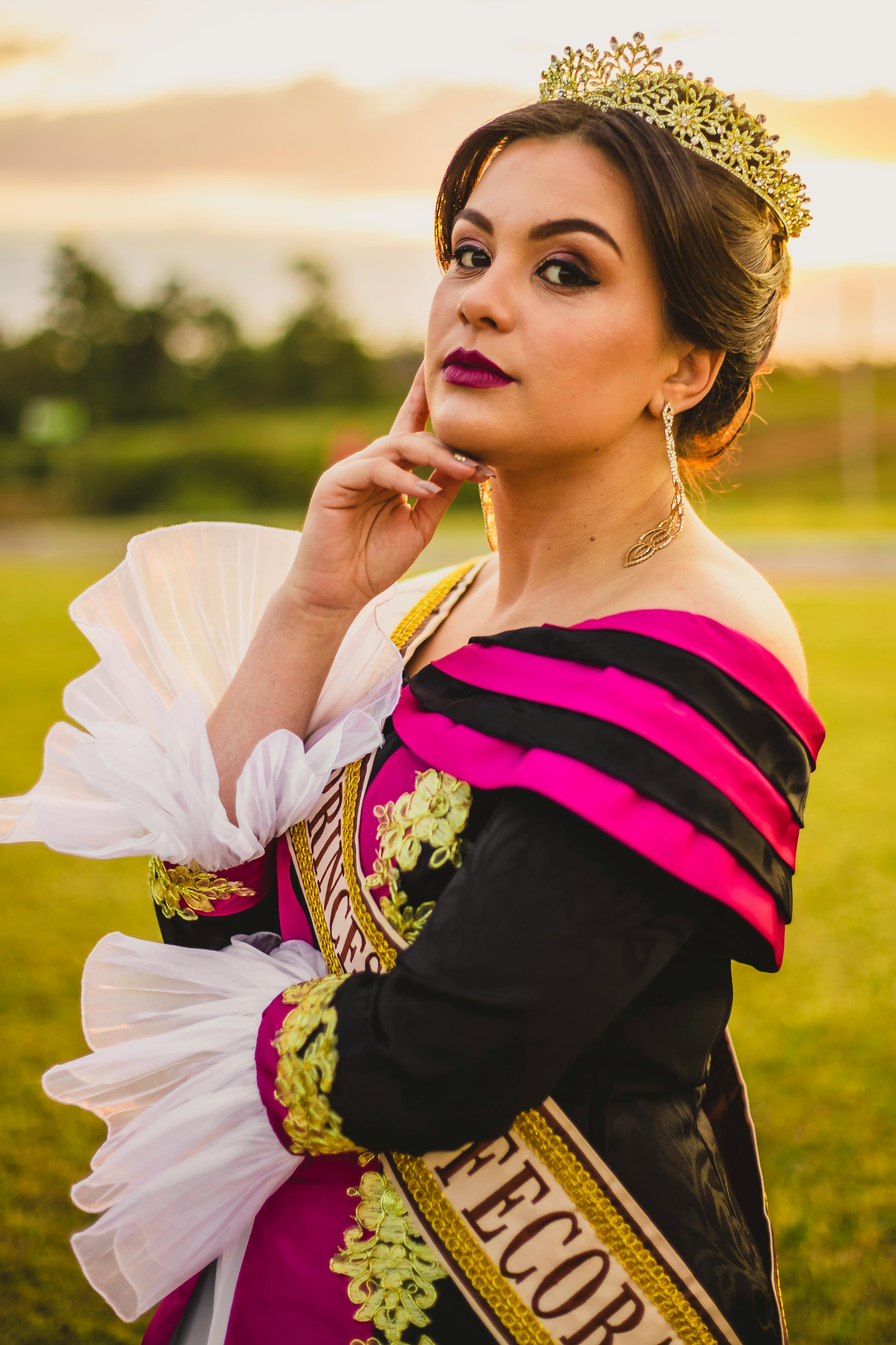 Cheerful ethnic beauty contest winner in elegant wear in park · Free ...