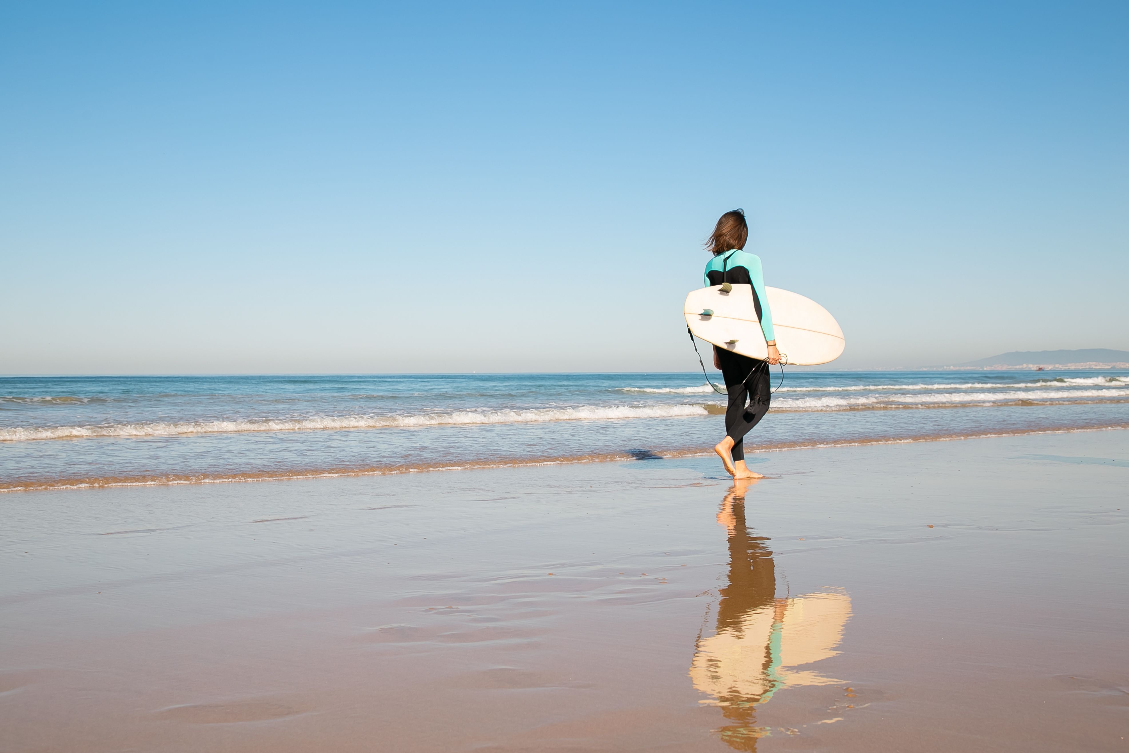 Surfer Walking on the Beach · Free Stock Photo