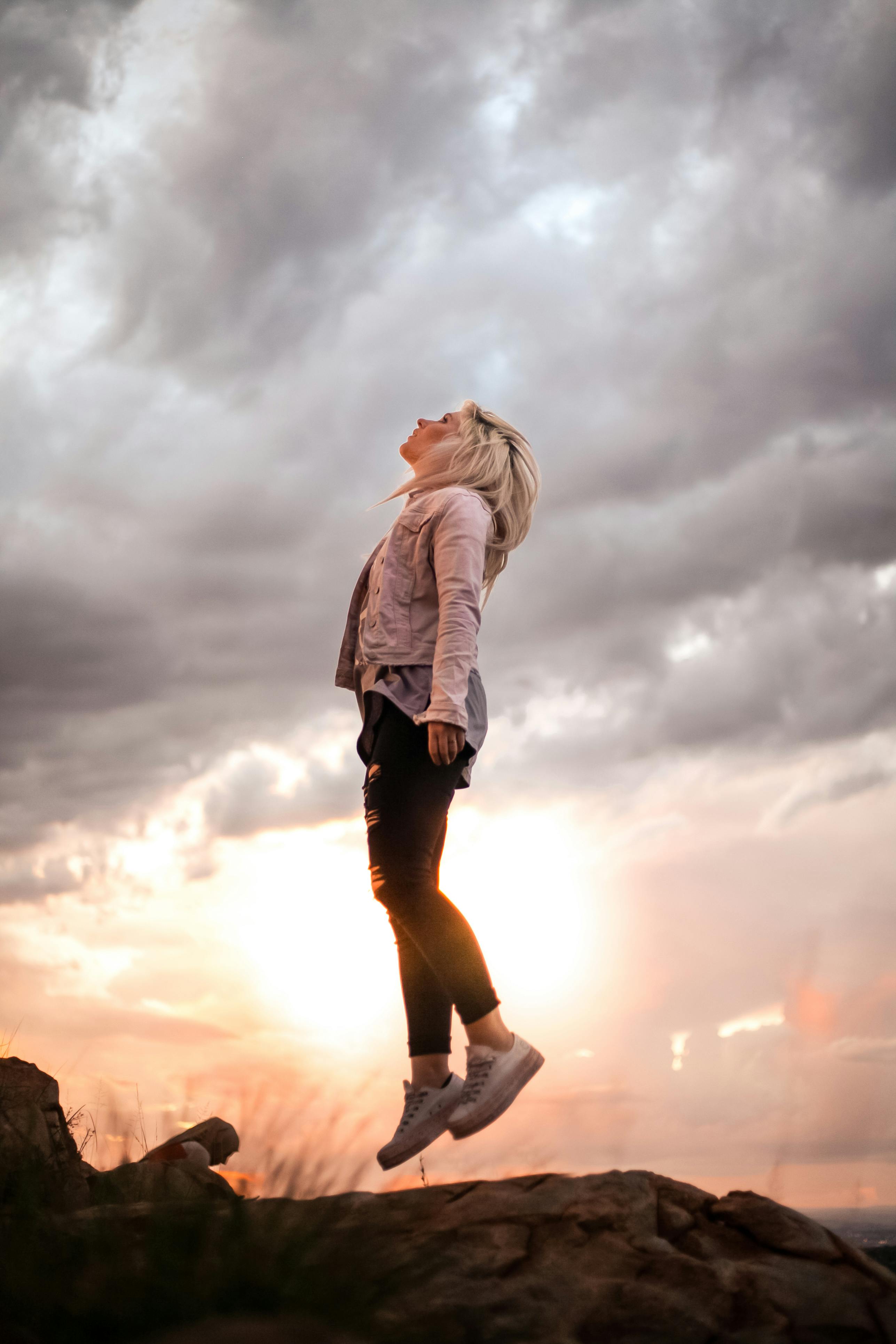 Woman Levitation Photo from a Rock Formation · Free Stock Photo