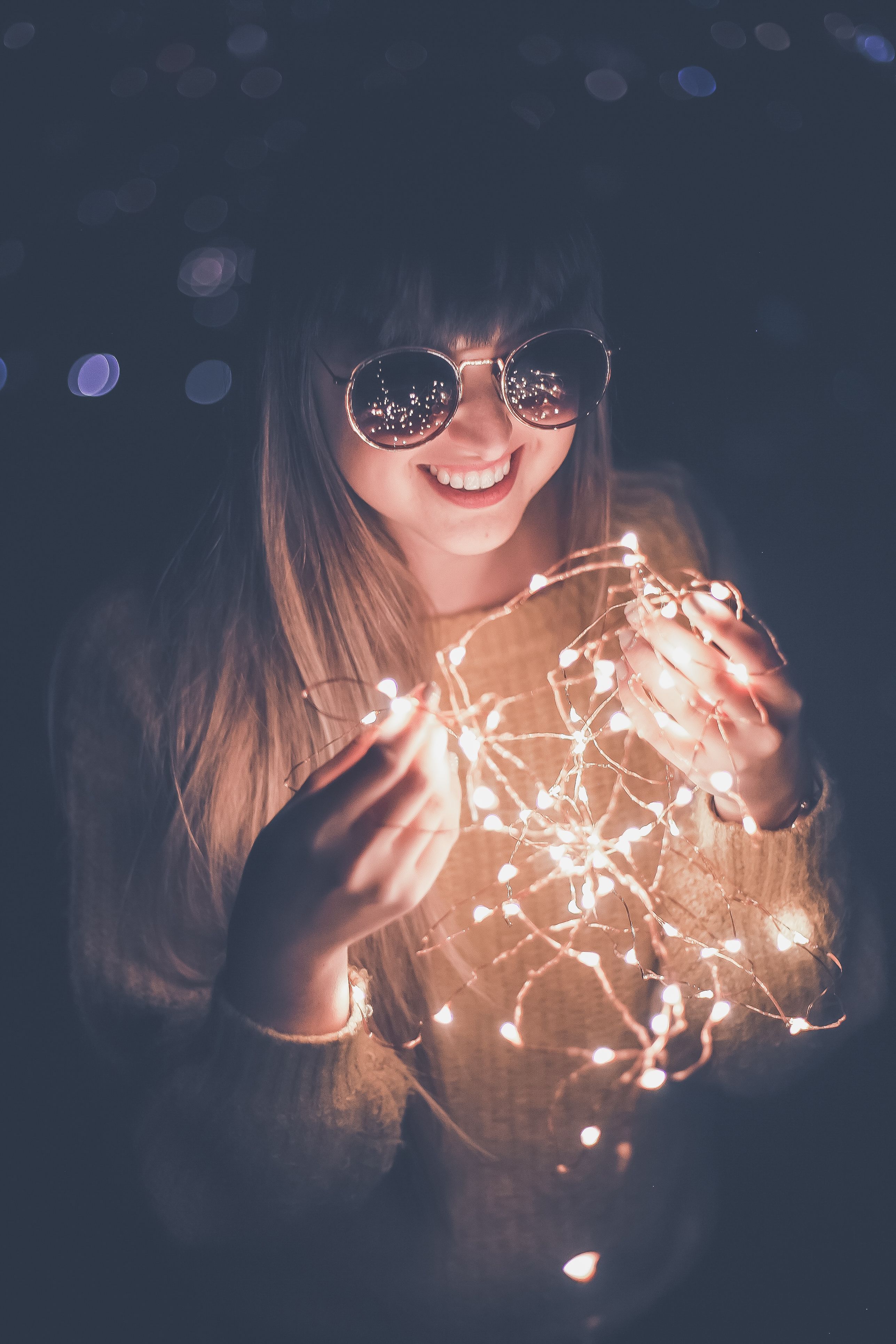 Photo of Woman Holding String Lights · Free Stock Photo