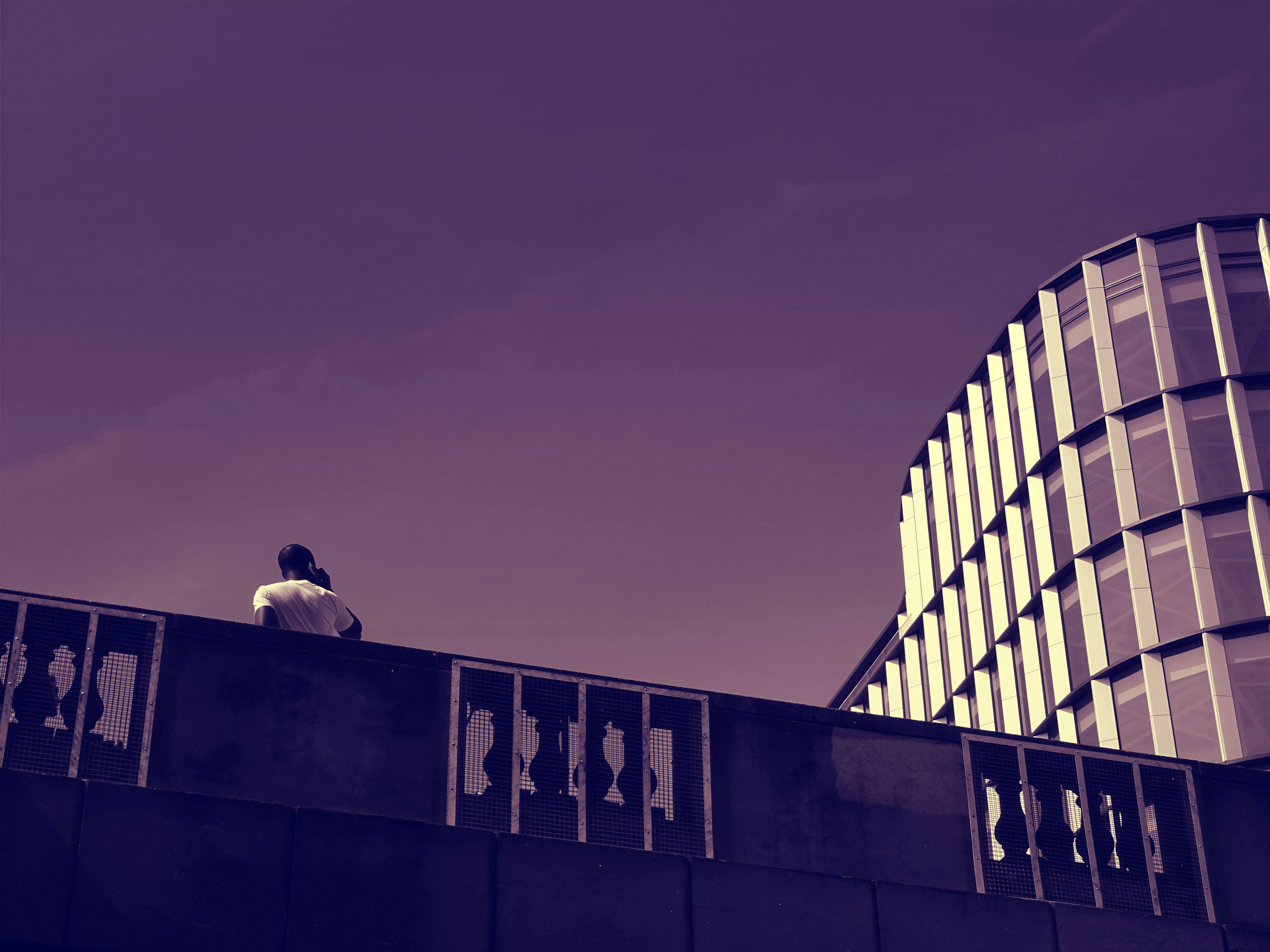 Person Standing Near Building · Free Stock Photo